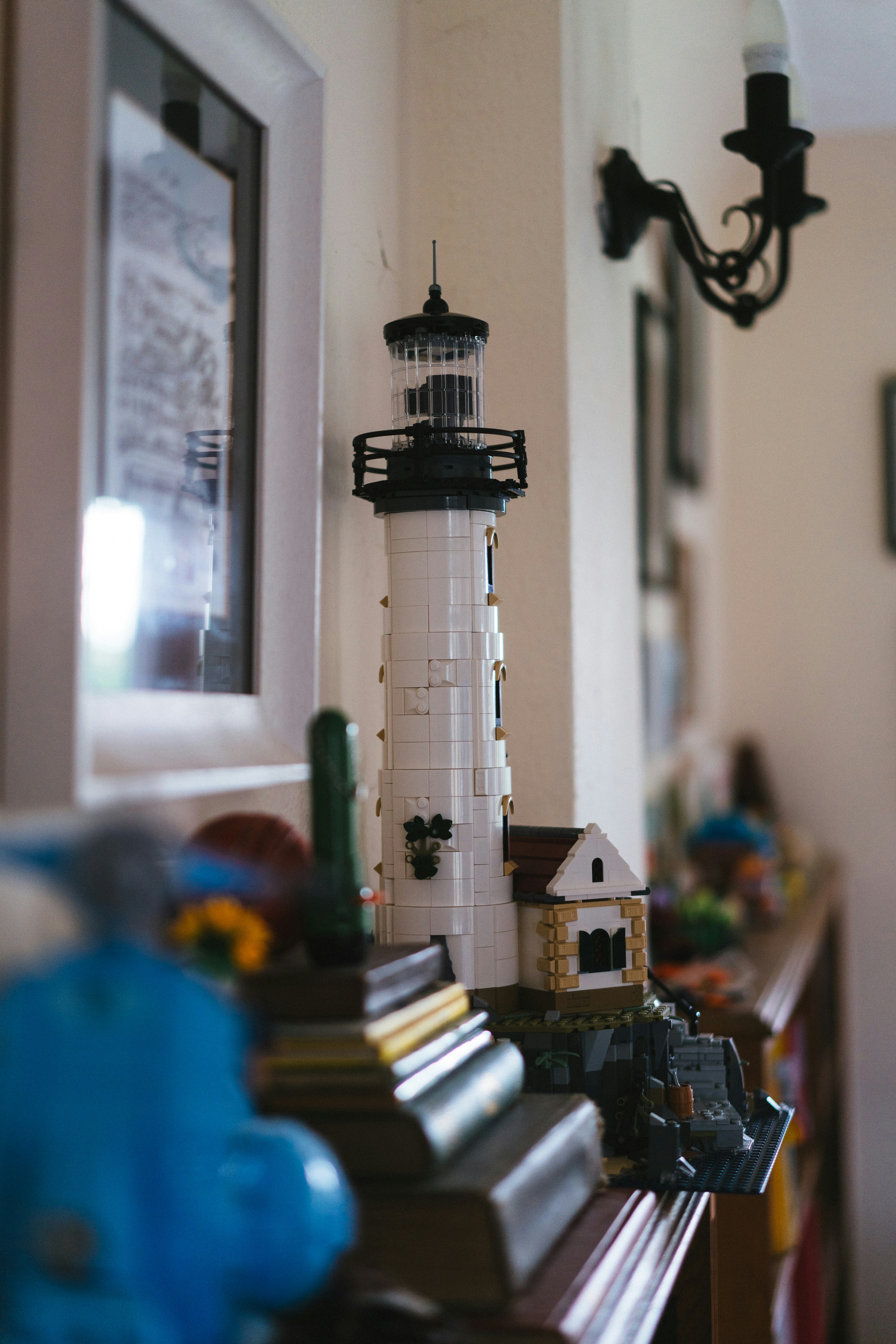 Brick Beacon on a Quiet Shelf: A LEGO Lighthouse in Indoor Still Life