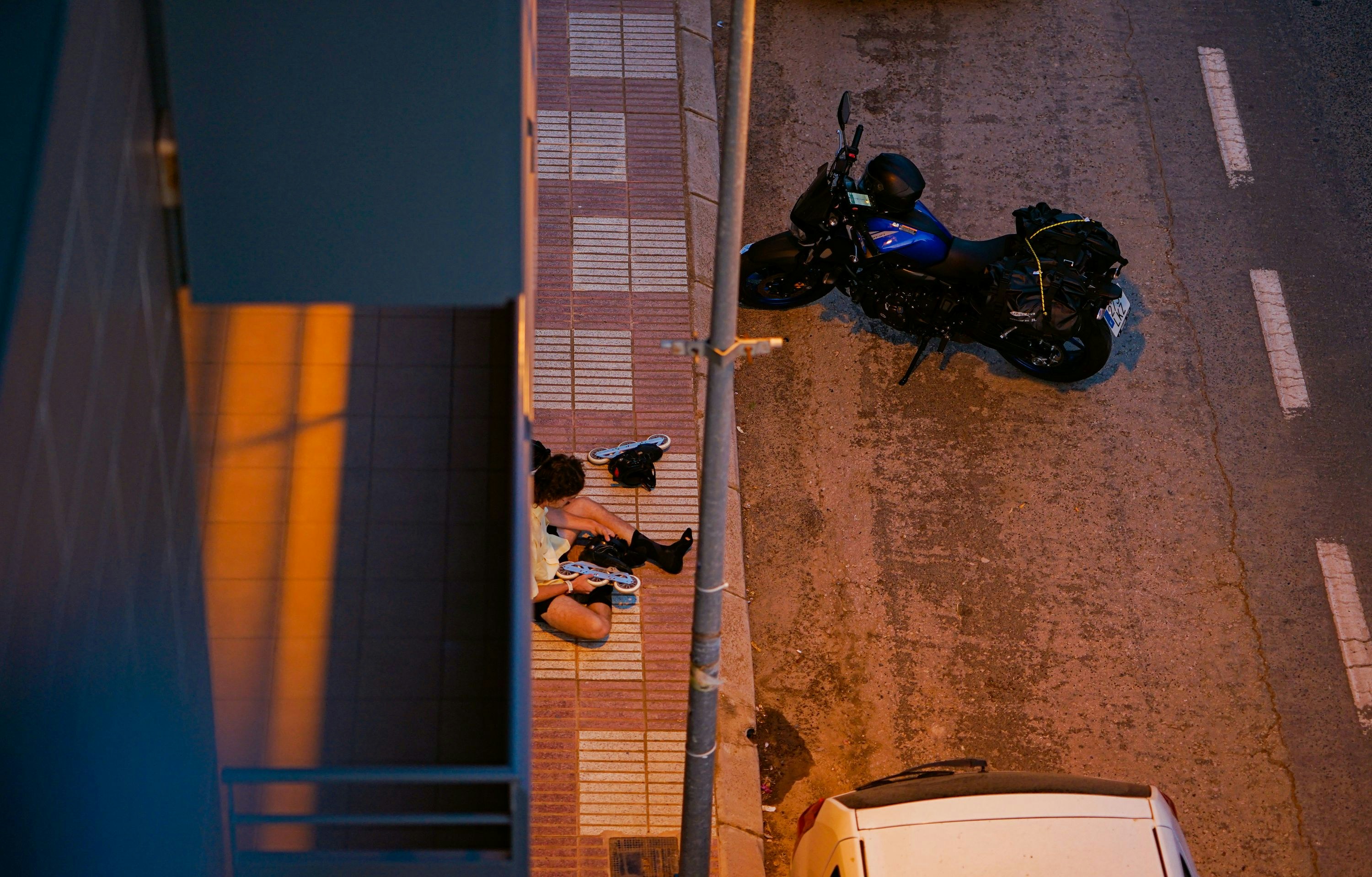 Edge of Dusk: A Parked Bike Under Warm Streetlight
