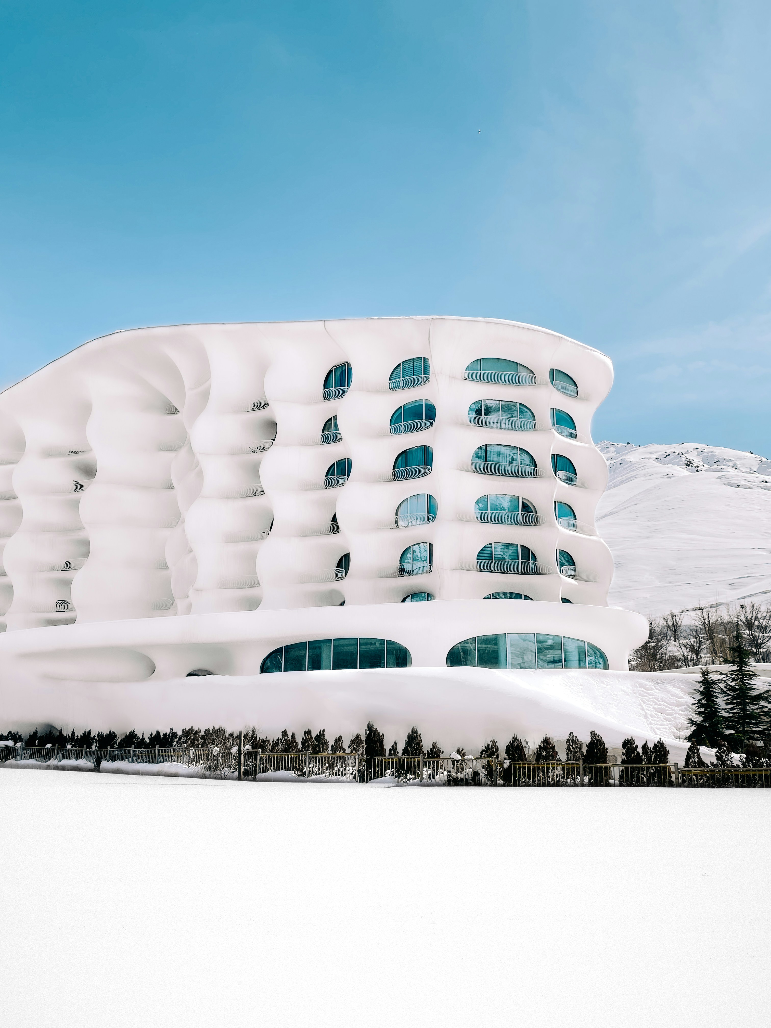 Curves in Ice: The Snowbound Pavilion Under a Crisp Blue Sky