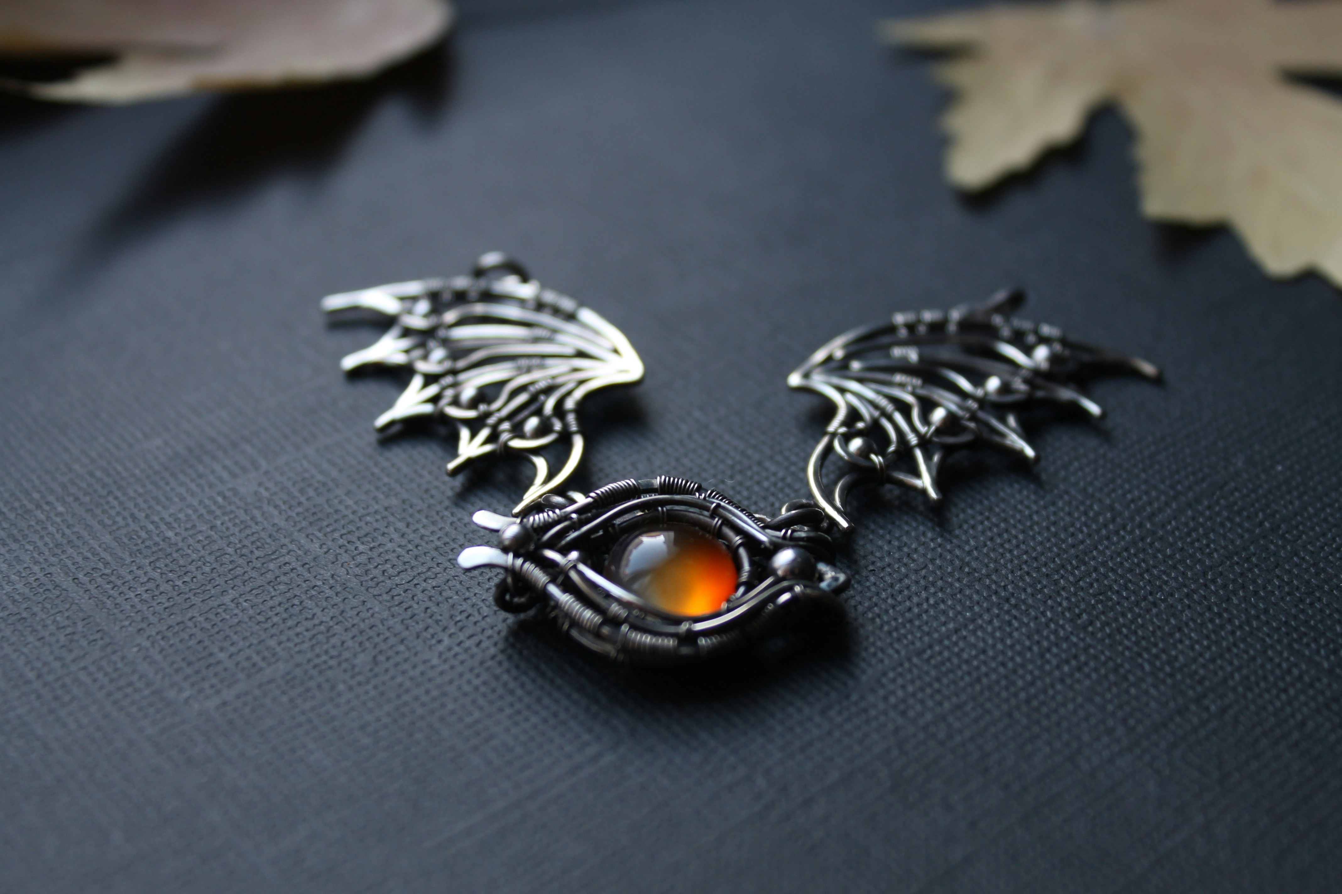 Emberwings Pendant: A Winged Jewel with a Glowing Core