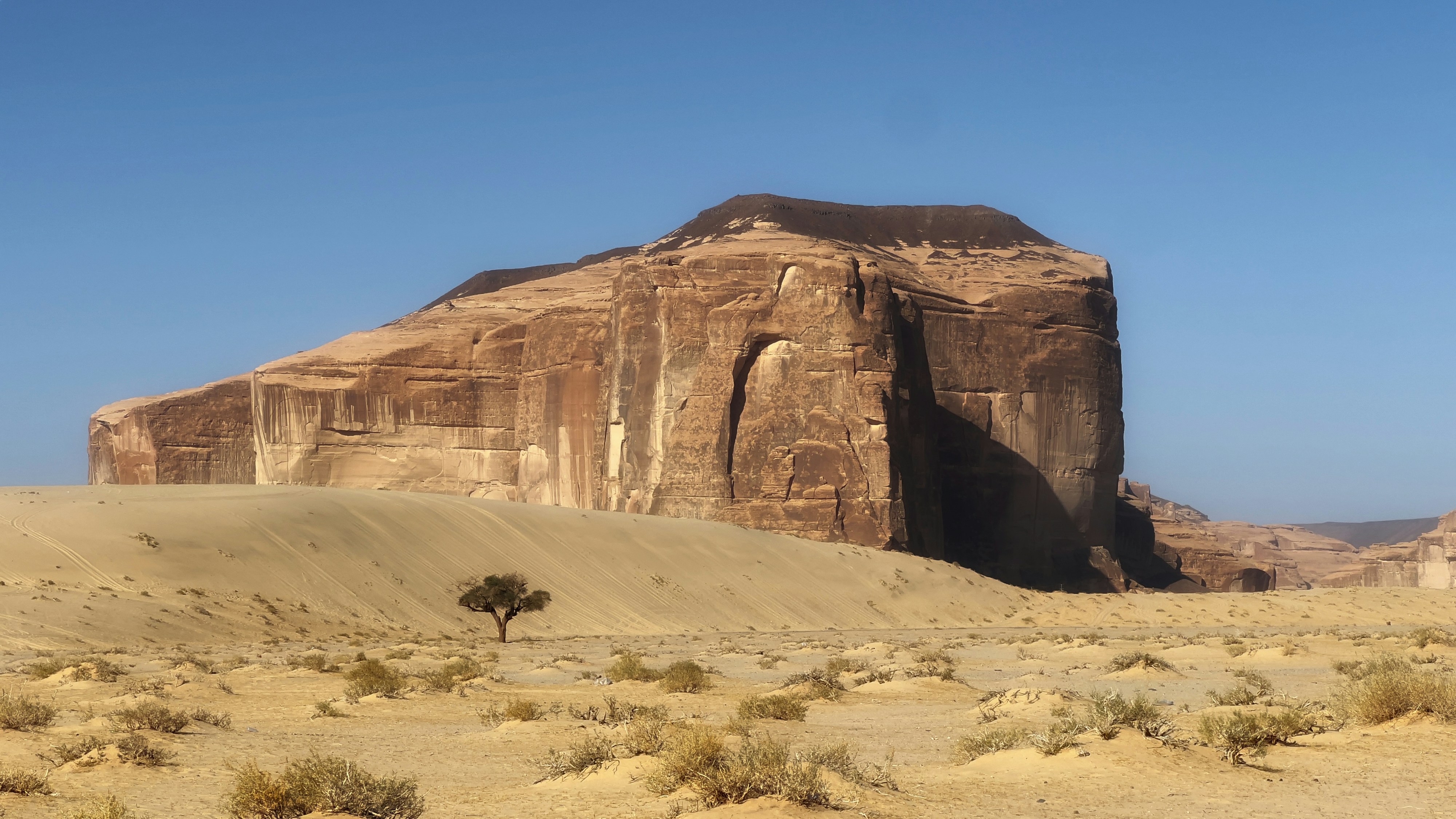 A large rock formation in the middle of a desert photo – Free Al-'ula ...