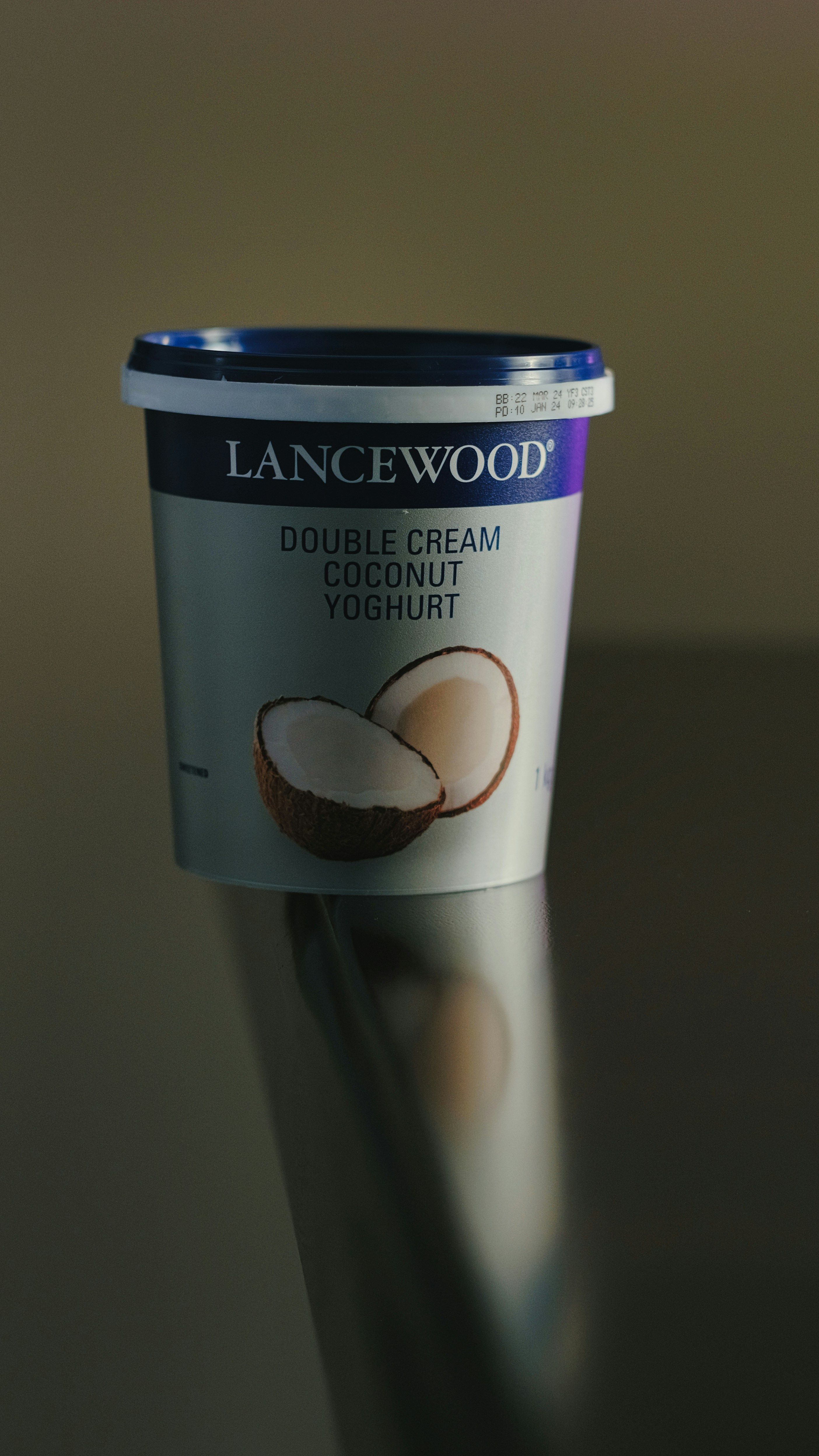 Lancewood Coconut Yogurt Cup: a Quiet Moment on a Reflective Surface