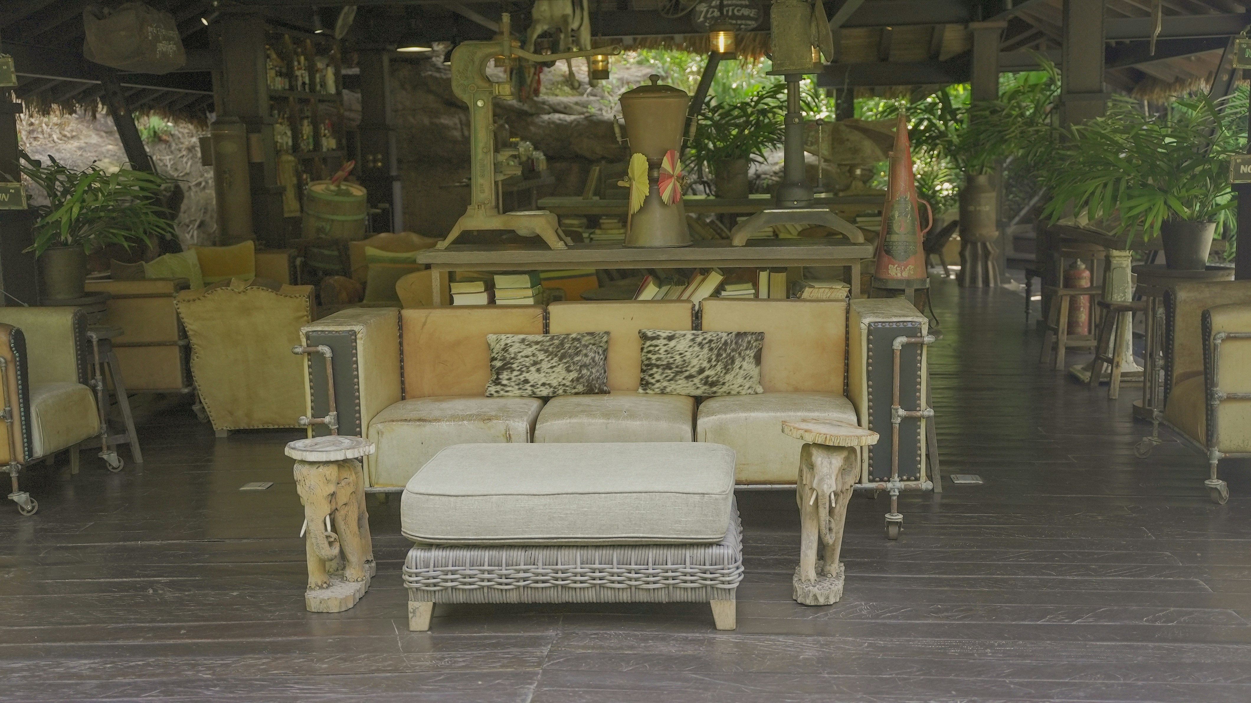 Open-Air Lounge: Wicker Seating Framed by Tropical Foliage