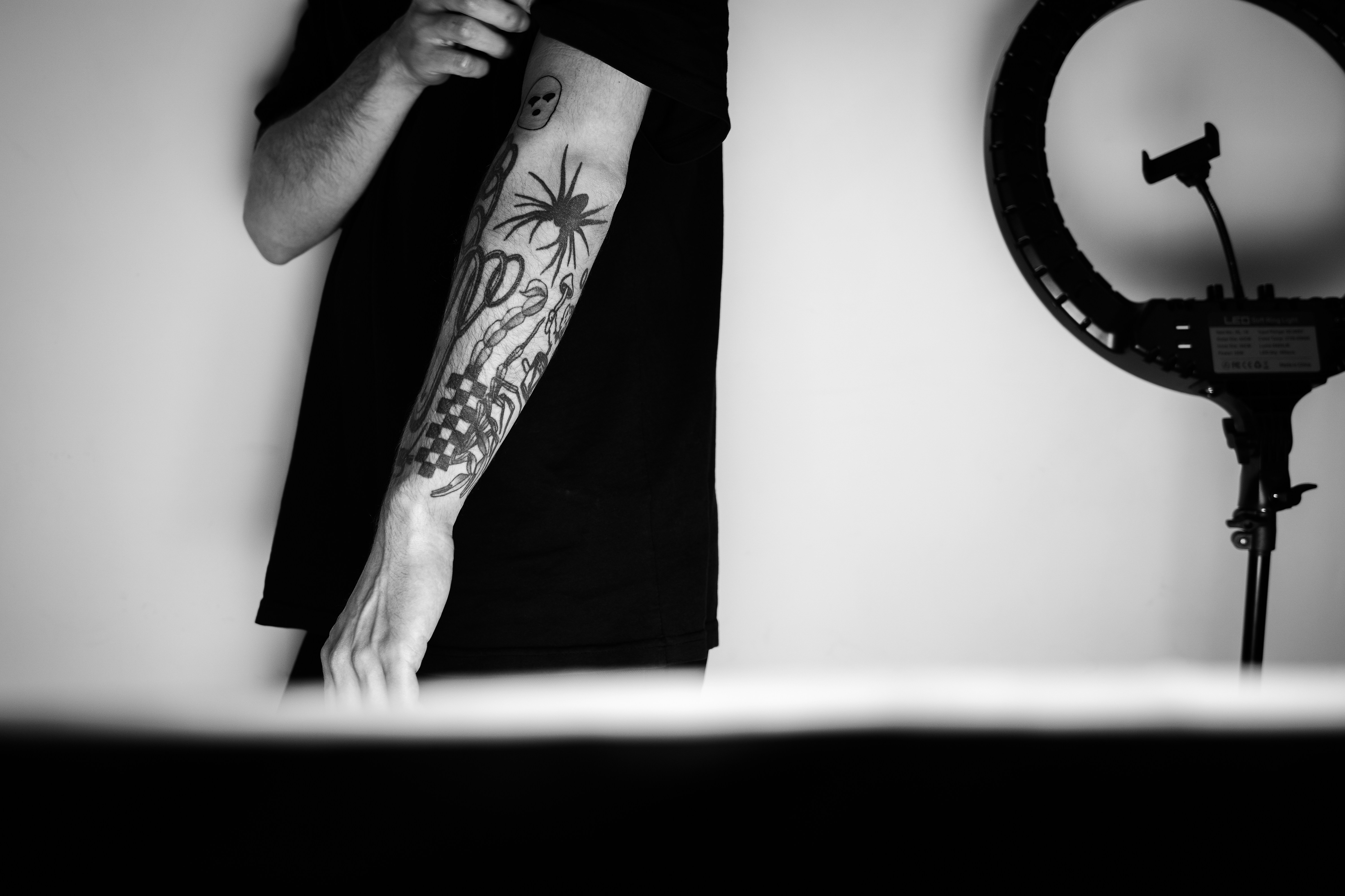 Ink and Light: A Minimal Studio Portrait of a Tattooed Forearm