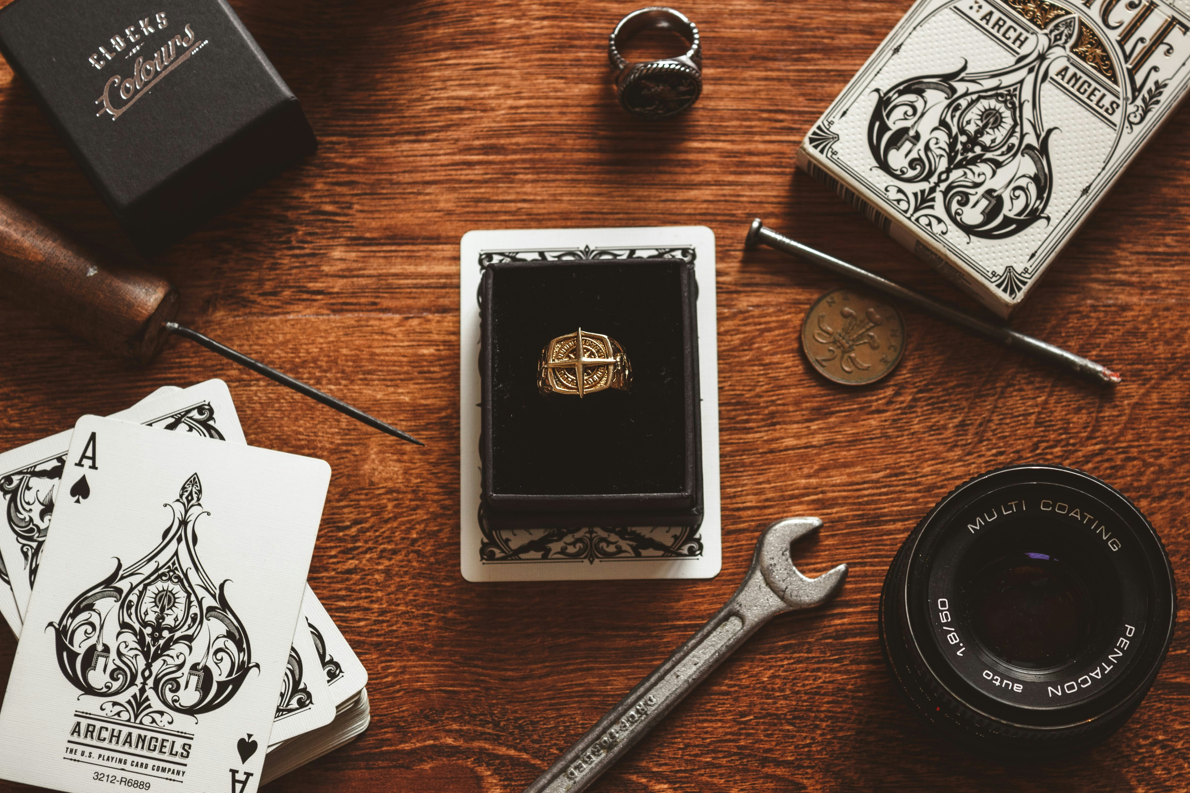 Ring in the Box: A Vintage Desk Scene of Cards, Tools, and Craft
