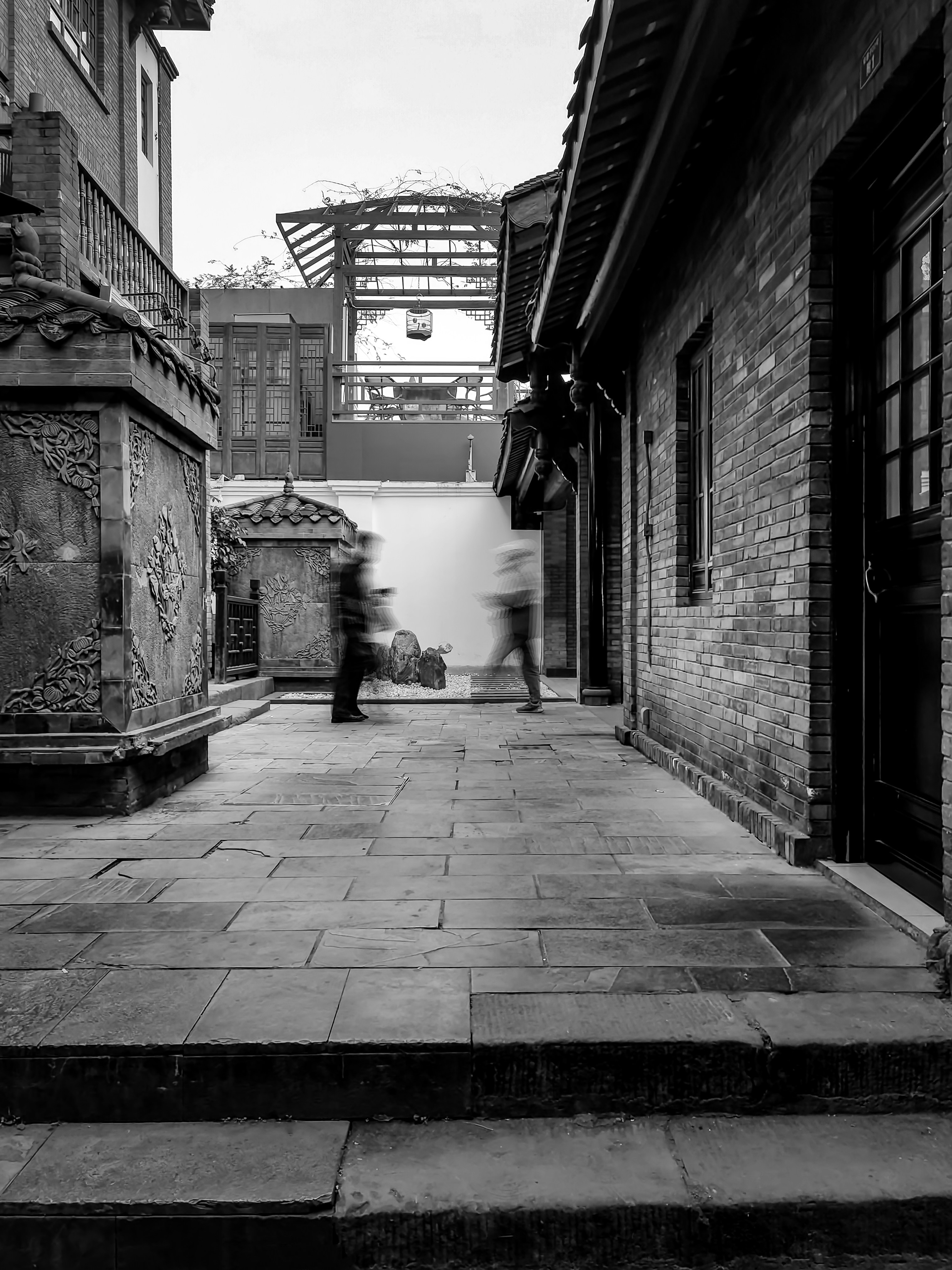 Midpoint Echoes: A Monochrome Alley Between Heritage and Modernity