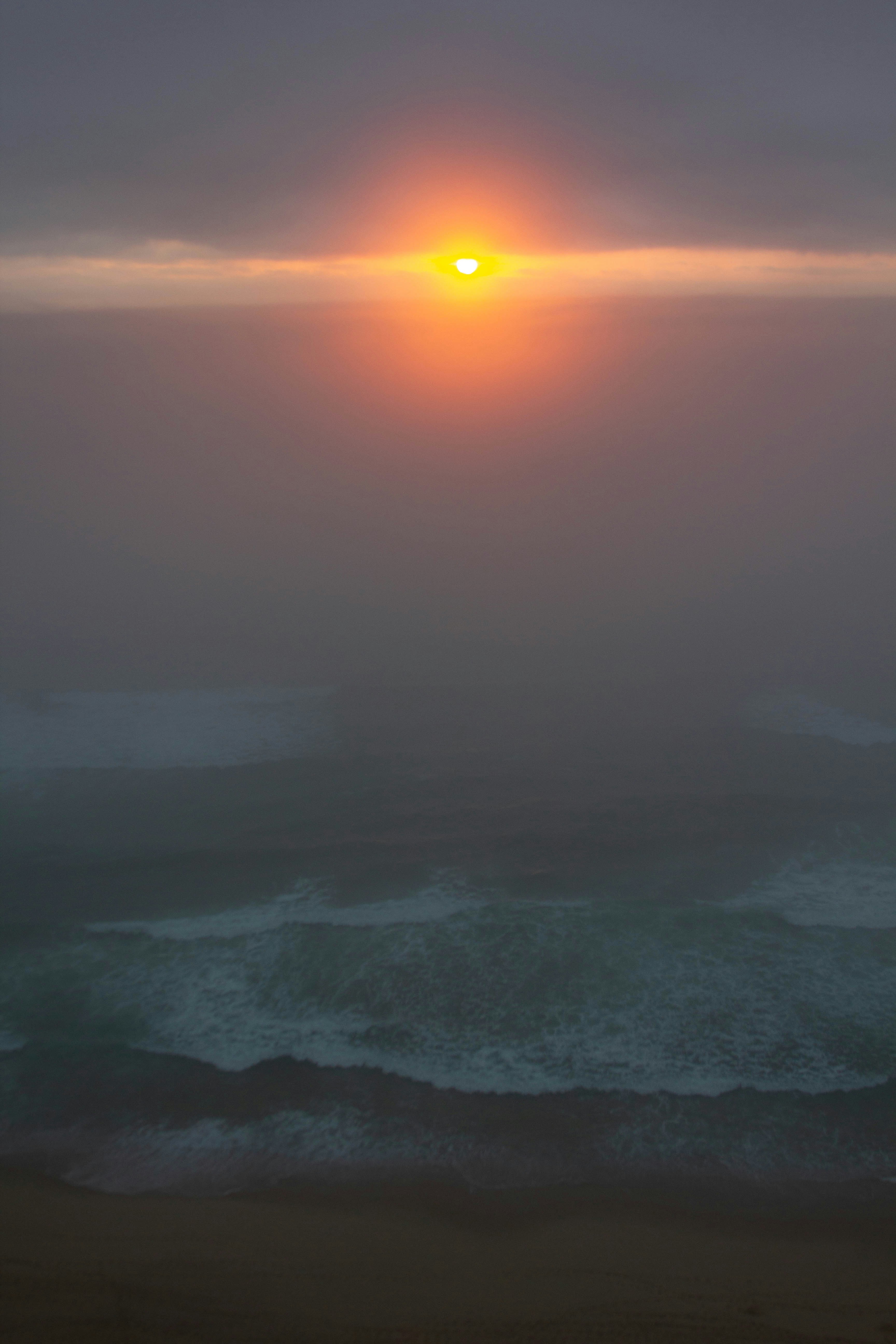 Sunlit Horizon Above a Quiet Wave