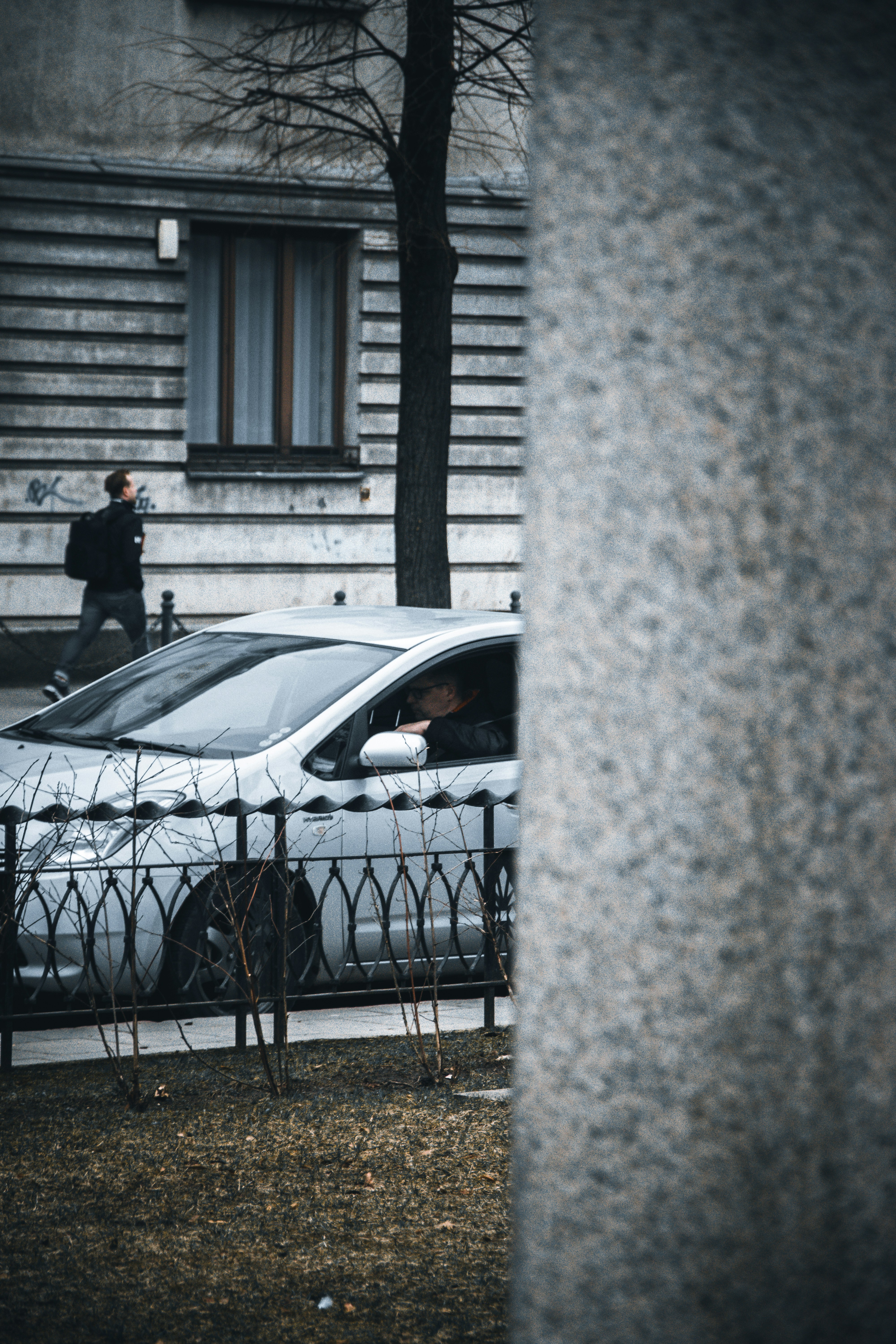 Took a picture of a guy sittin in a car.