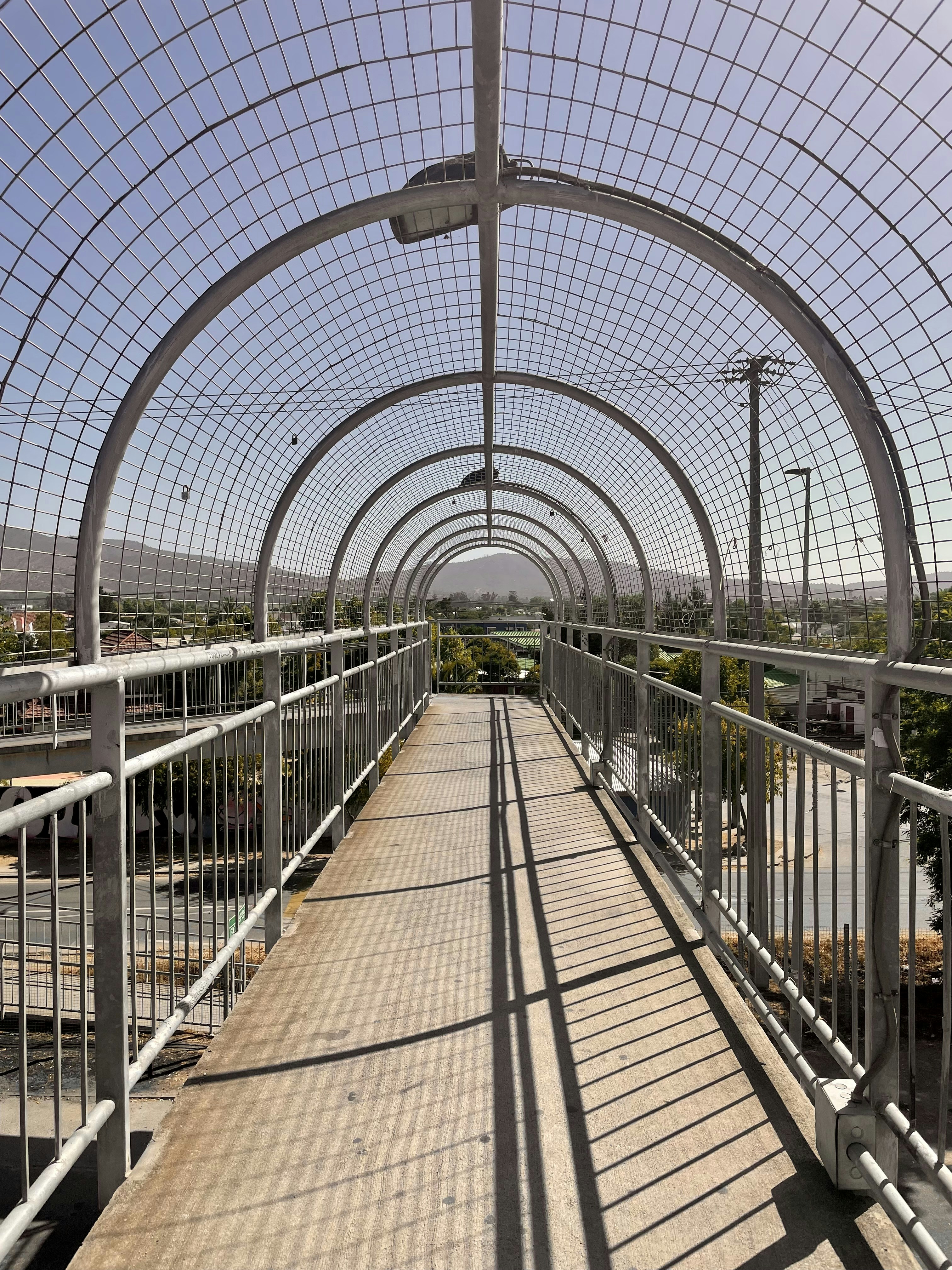 Concentric Skywalk: A Metal Tunnel to the Horizon