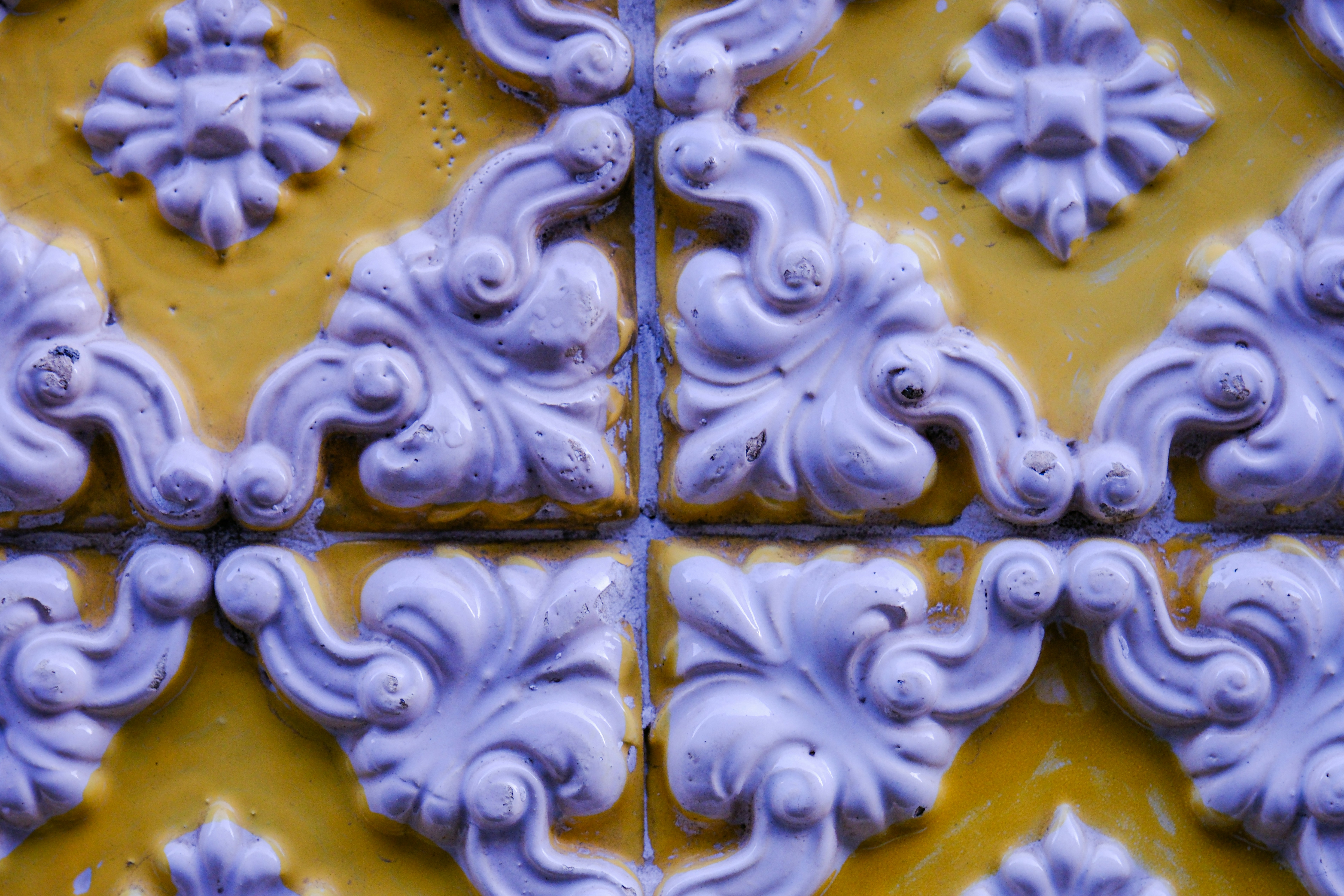 Lavender Rococo Tiles: A Symmetrical Mosaic of Curves on Yellow