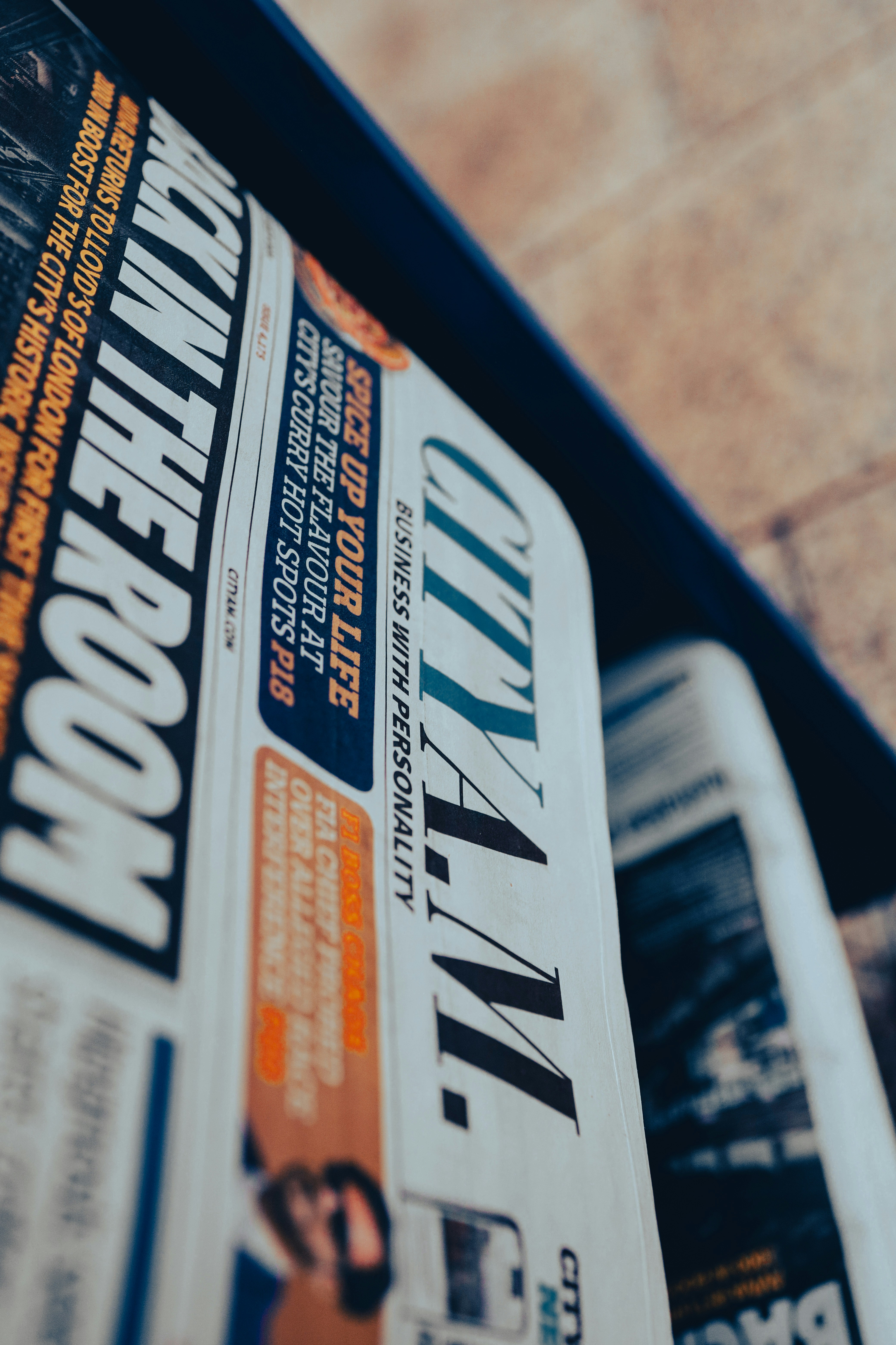 Tilted Headlines: A Close-Up of Bold Newspaper Typography