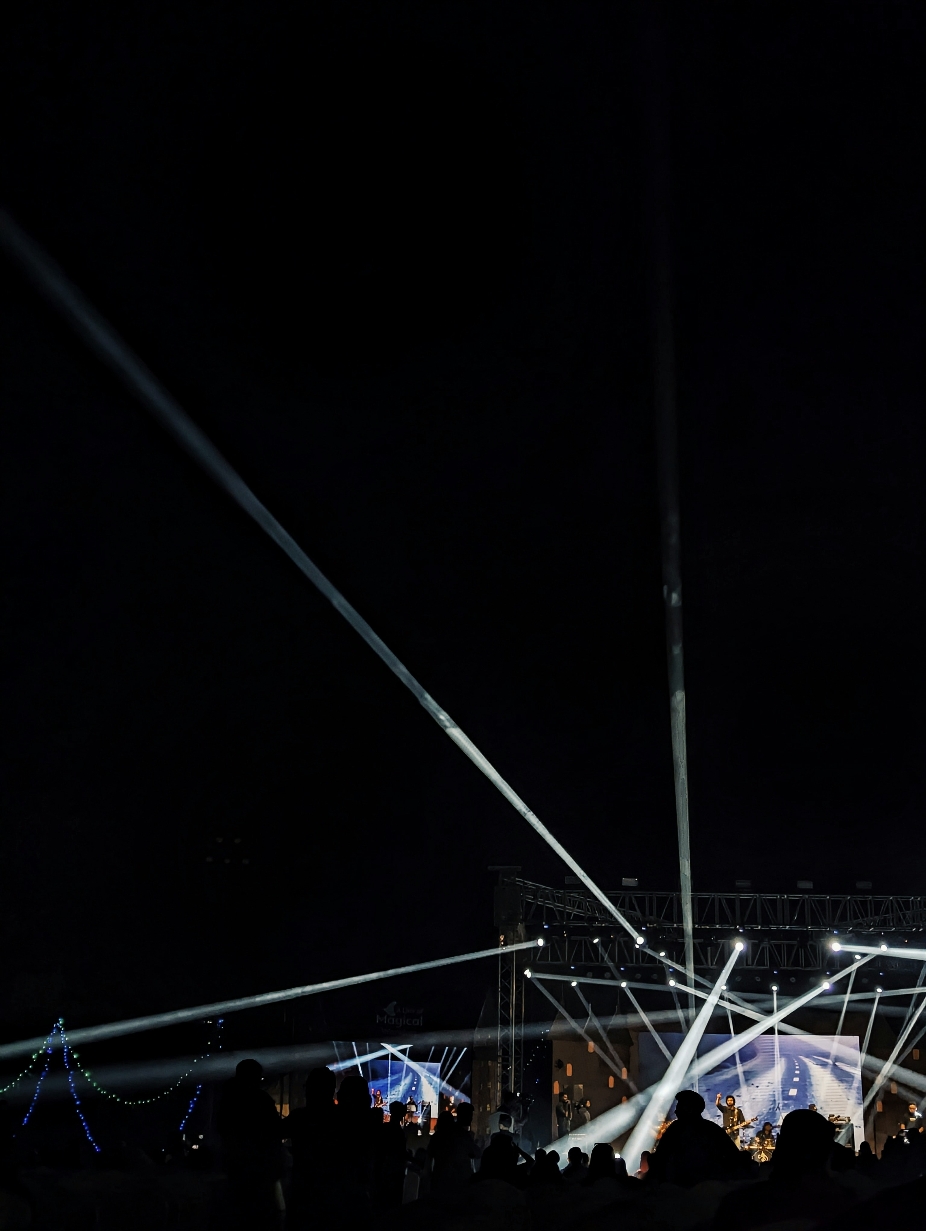 A crowd of people standing around a stage photo – Free Concert Image on ...