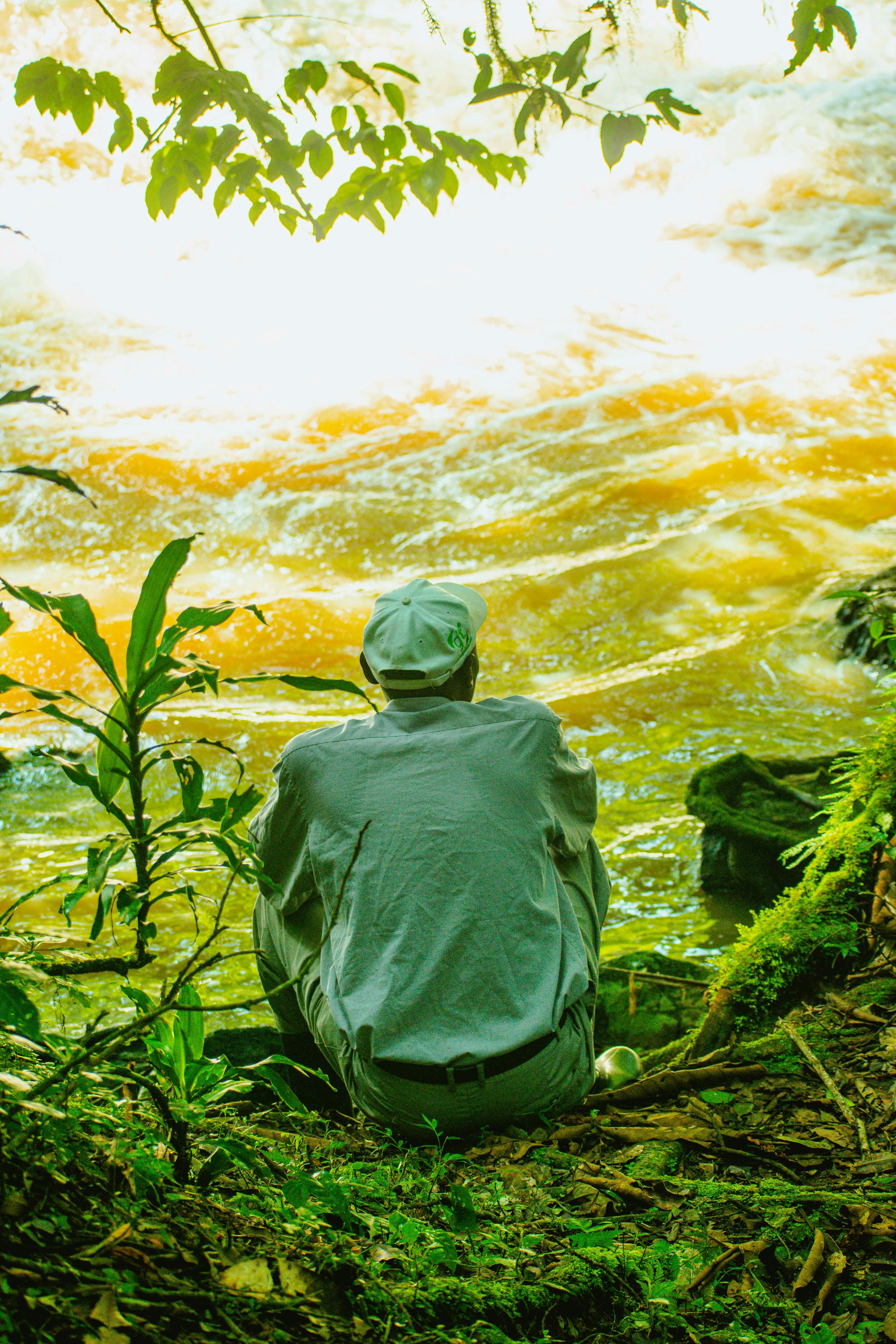 At the Riverside Edge: A Quiet Moment with a Reclining Figure
