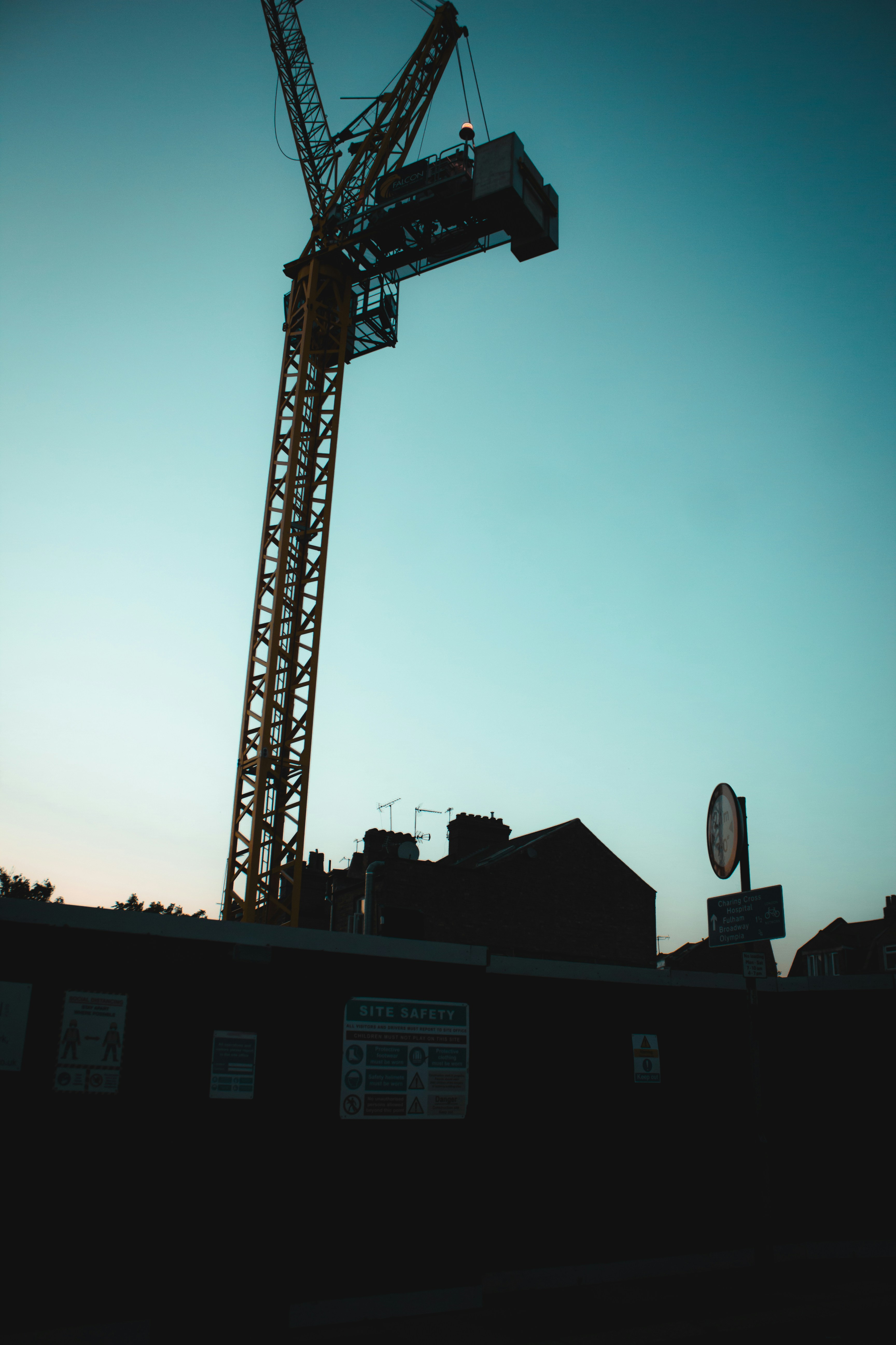 Crane Silhouette at Dusk: A Quiet Suburban Skyline