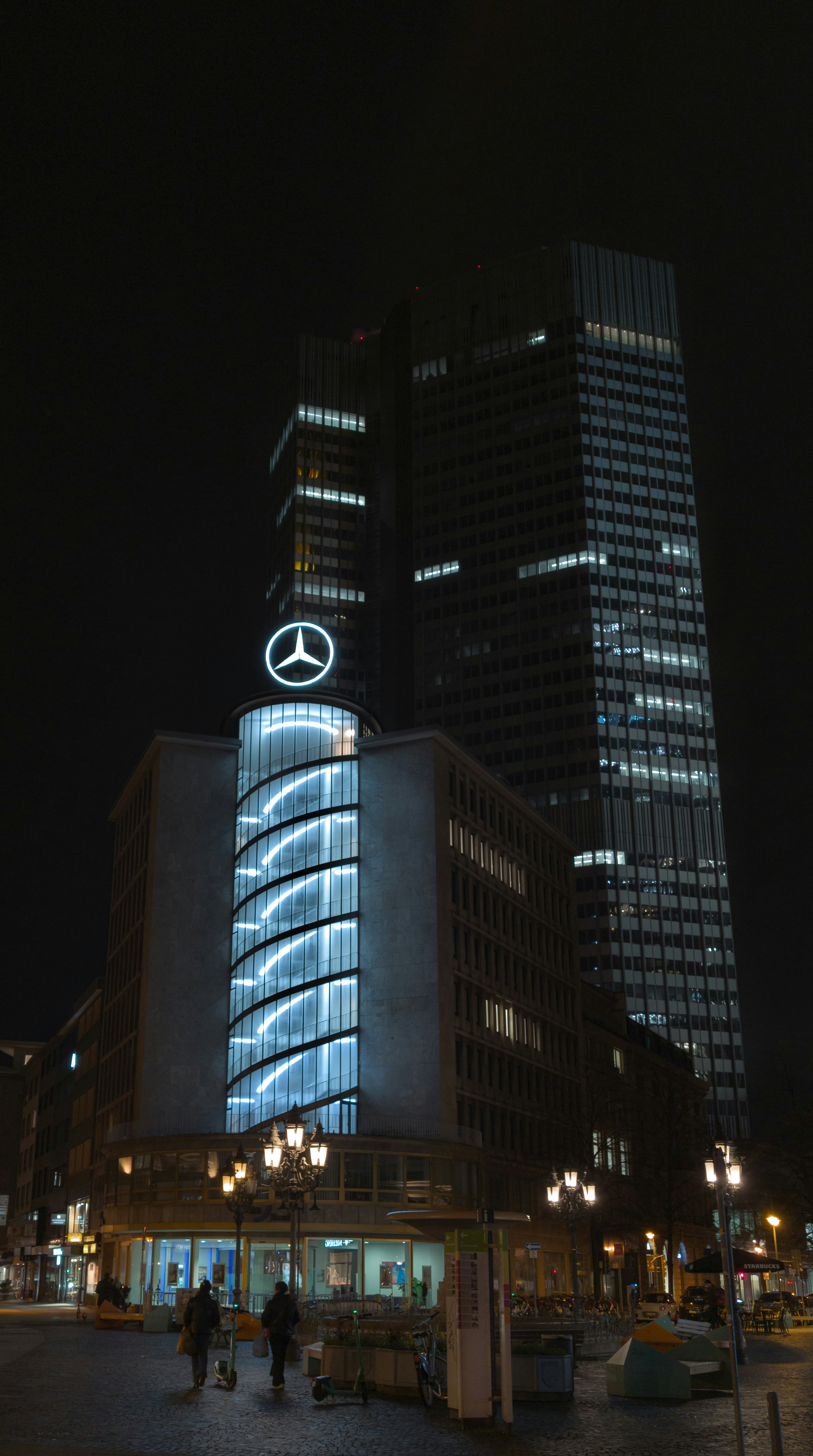 Spiraled Blue Neon Above the Mercedes Tower at Night