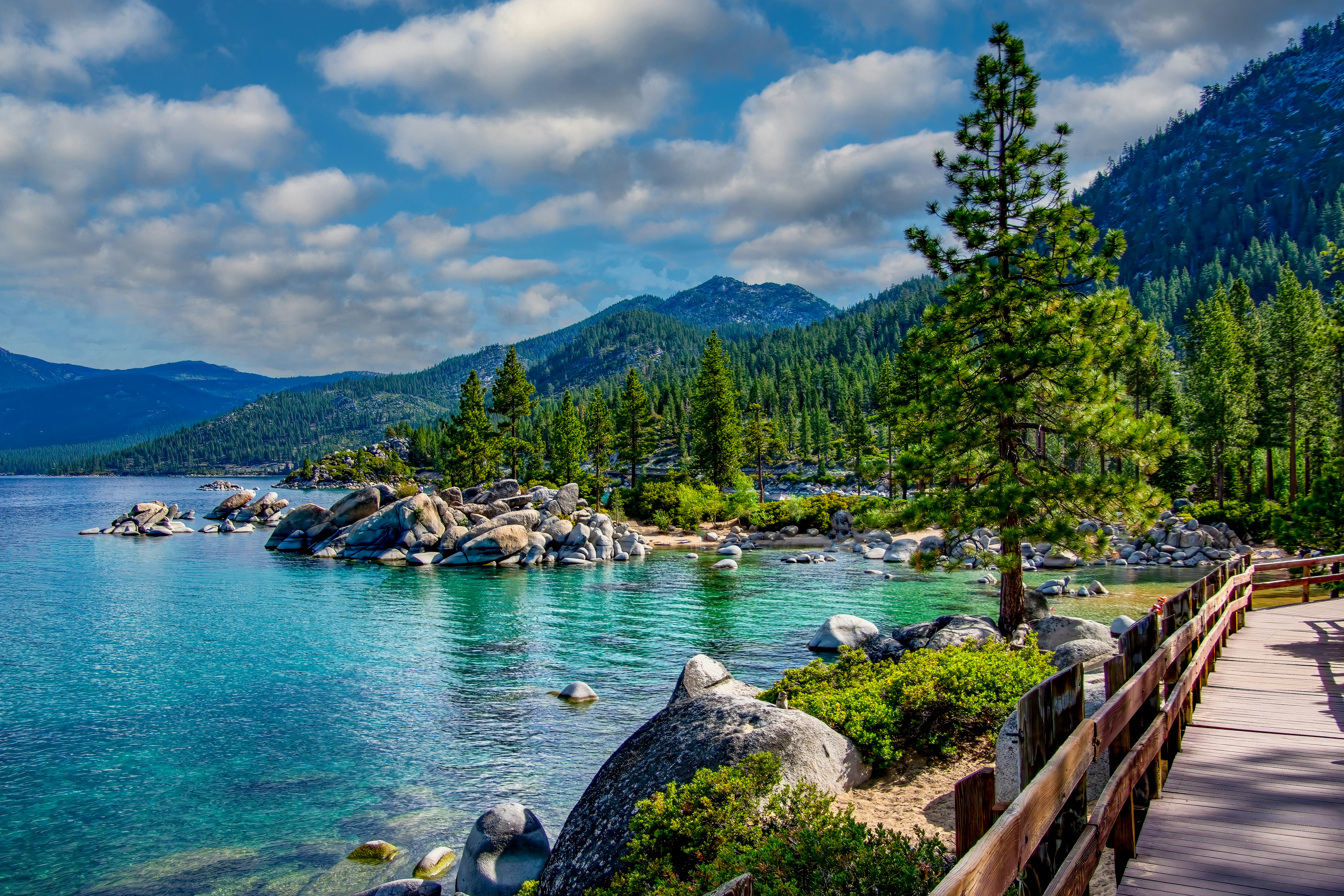 A scenic view of a lake surrounded by mountains photo – Free Lake tahoe ...