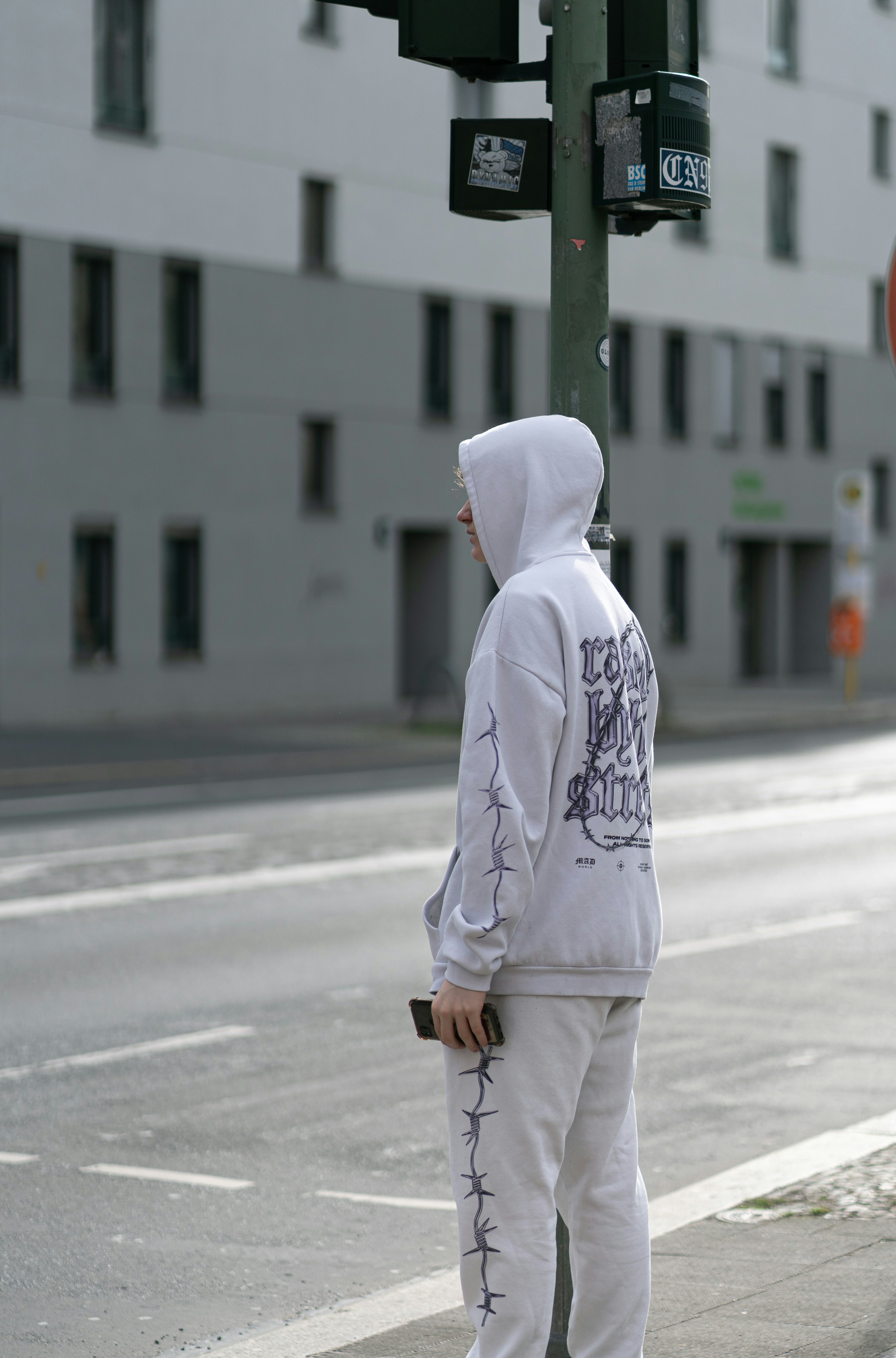 Hooded Stranger at a City Crosswalk