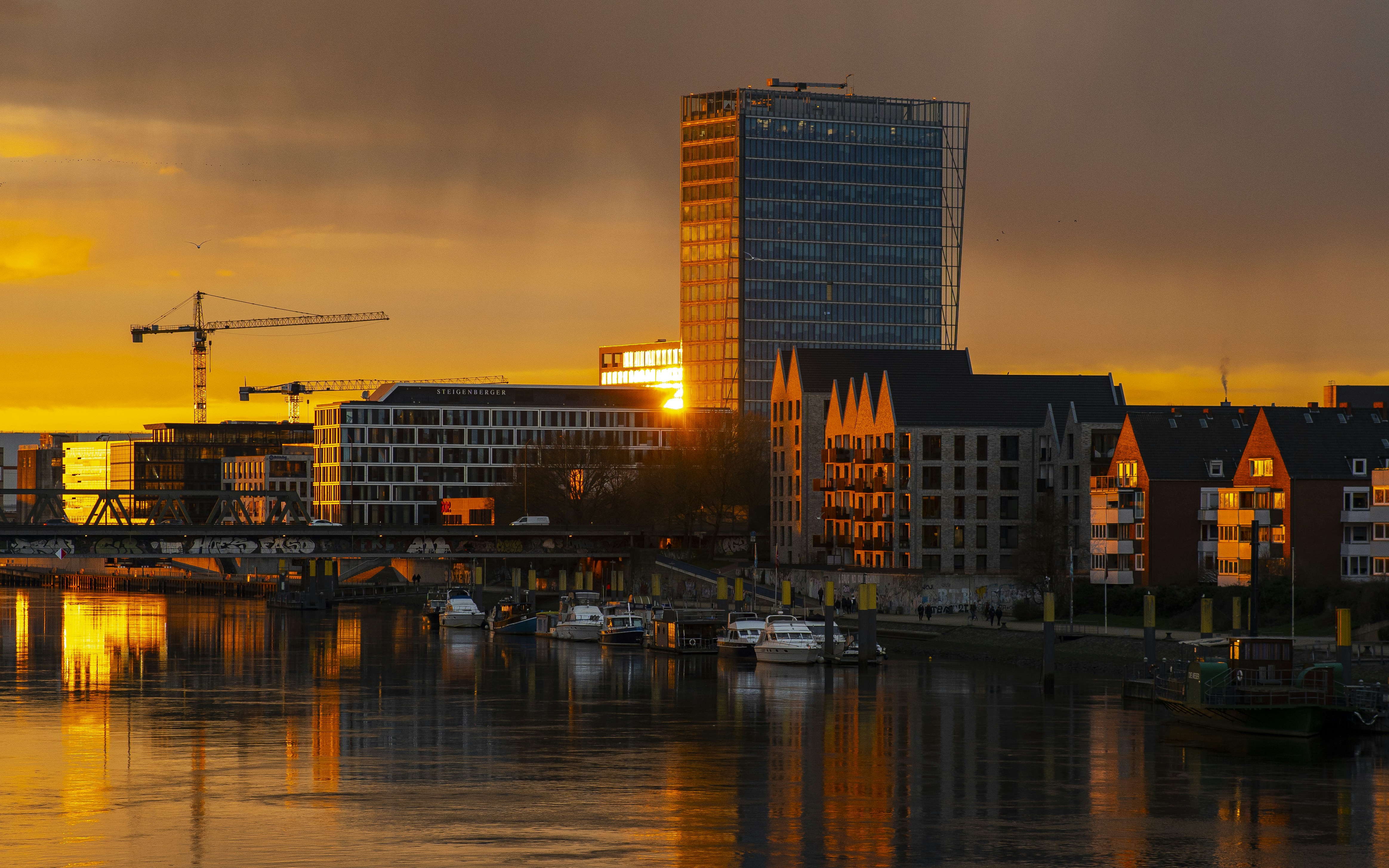 A view of a city with a bridge in the foreground photo – Free Bremen ...