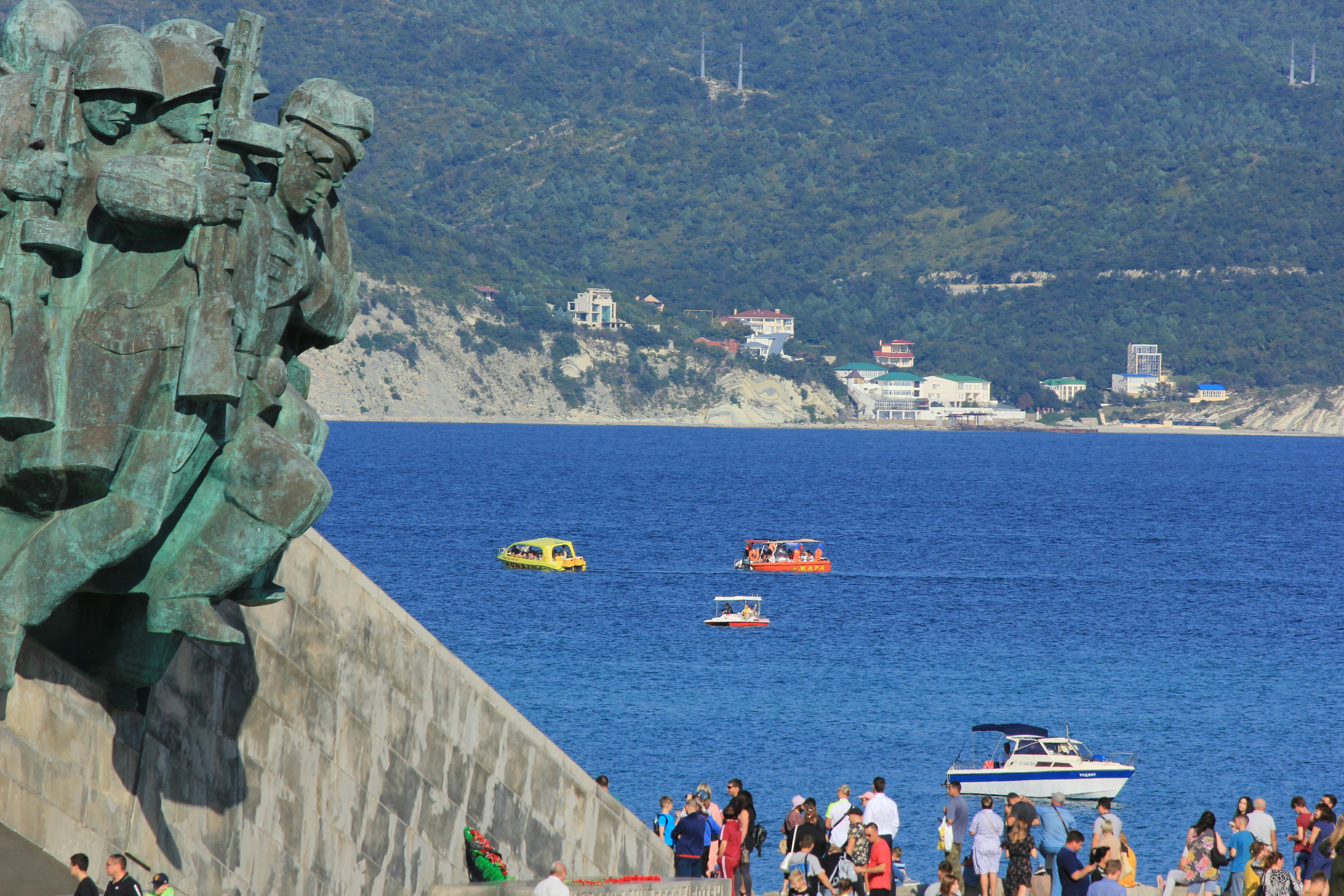 Bronze Guardians Guard a Sunlit Harbor