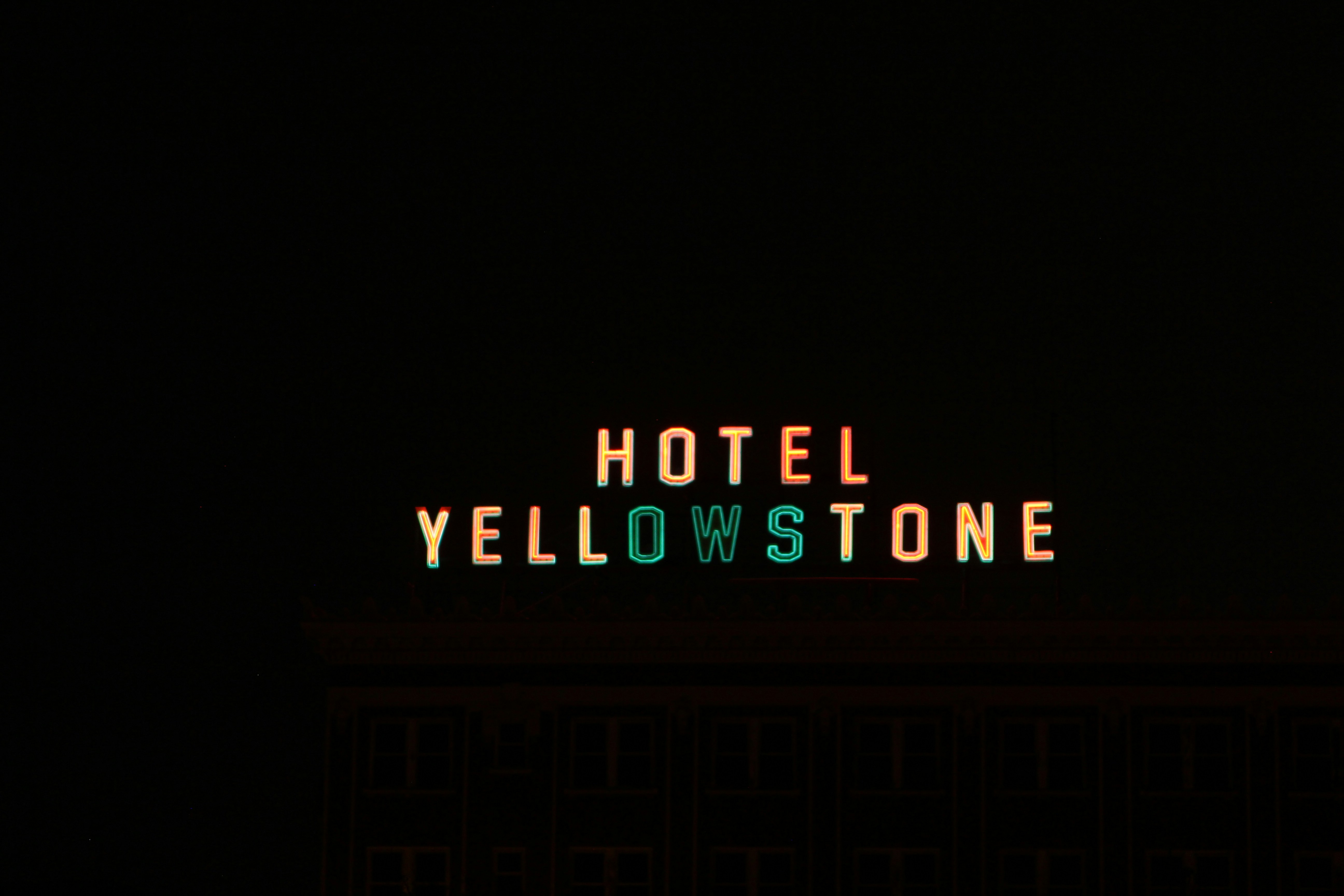 Neon Hotel Yellowstone Sign Quietly Glows in the Night