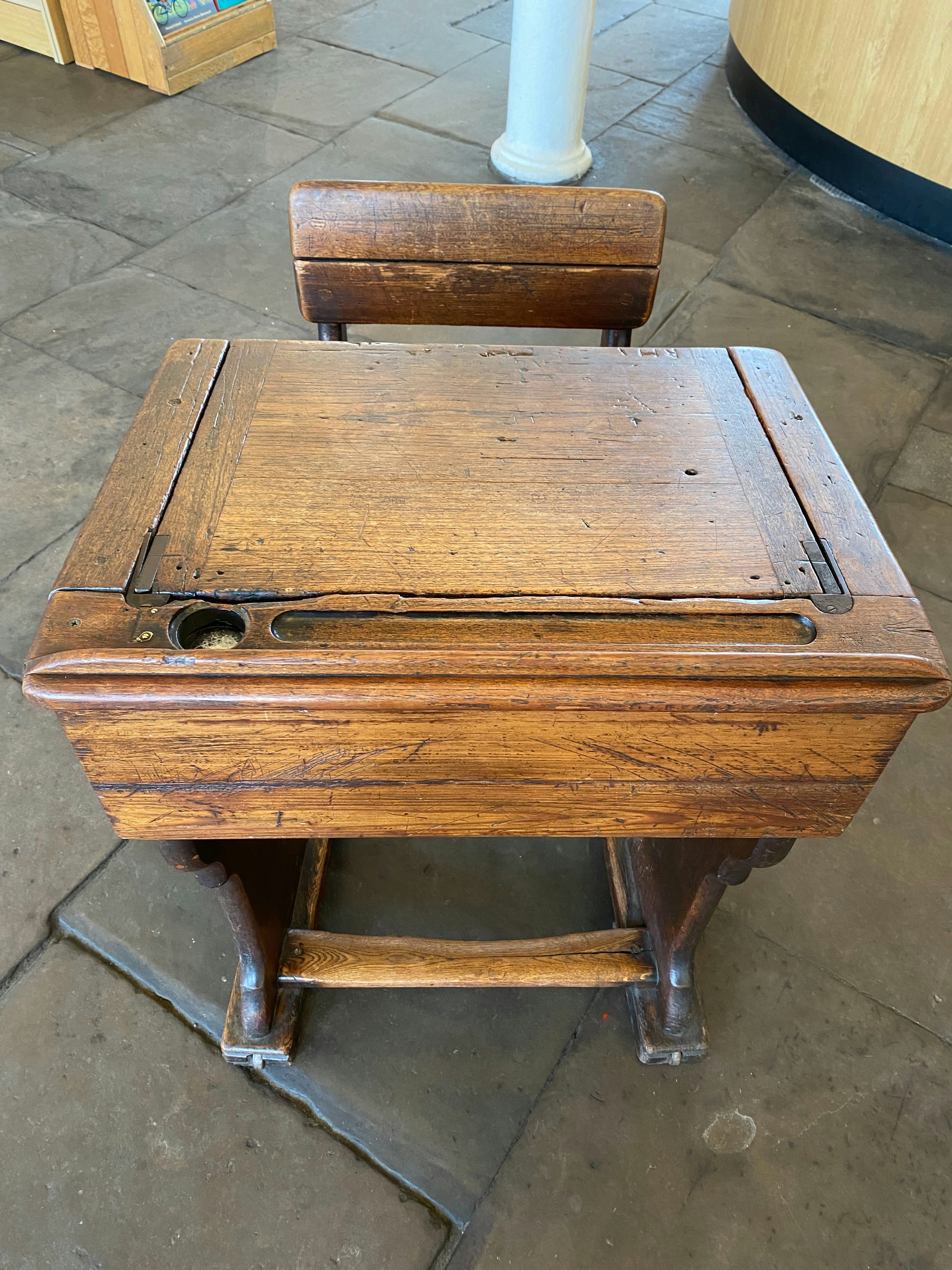 Vintage wooden school desk with inset pencil groove and single chair