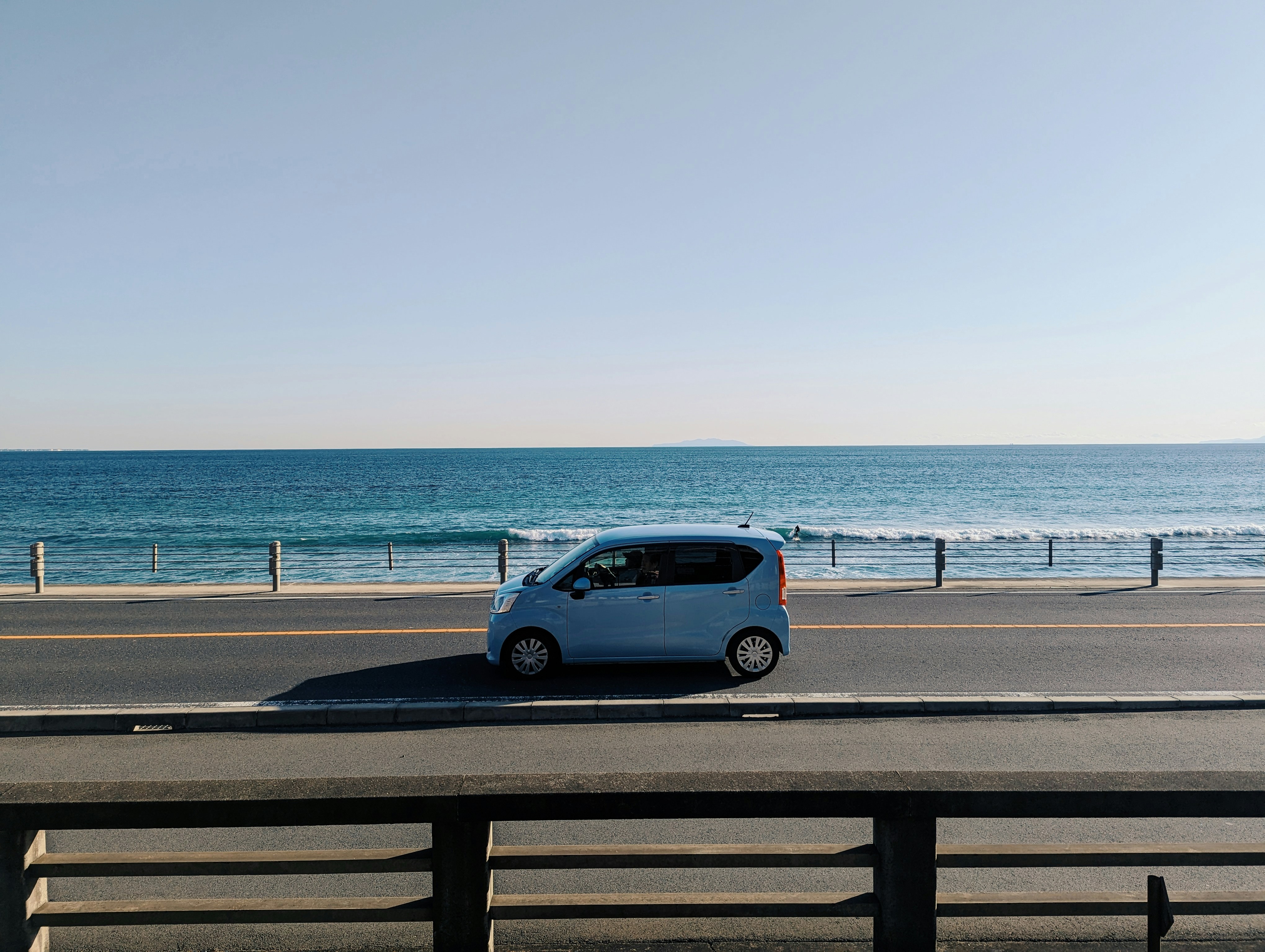 Azure Compact on a Seaside Drive Under a Clear Blue Sky