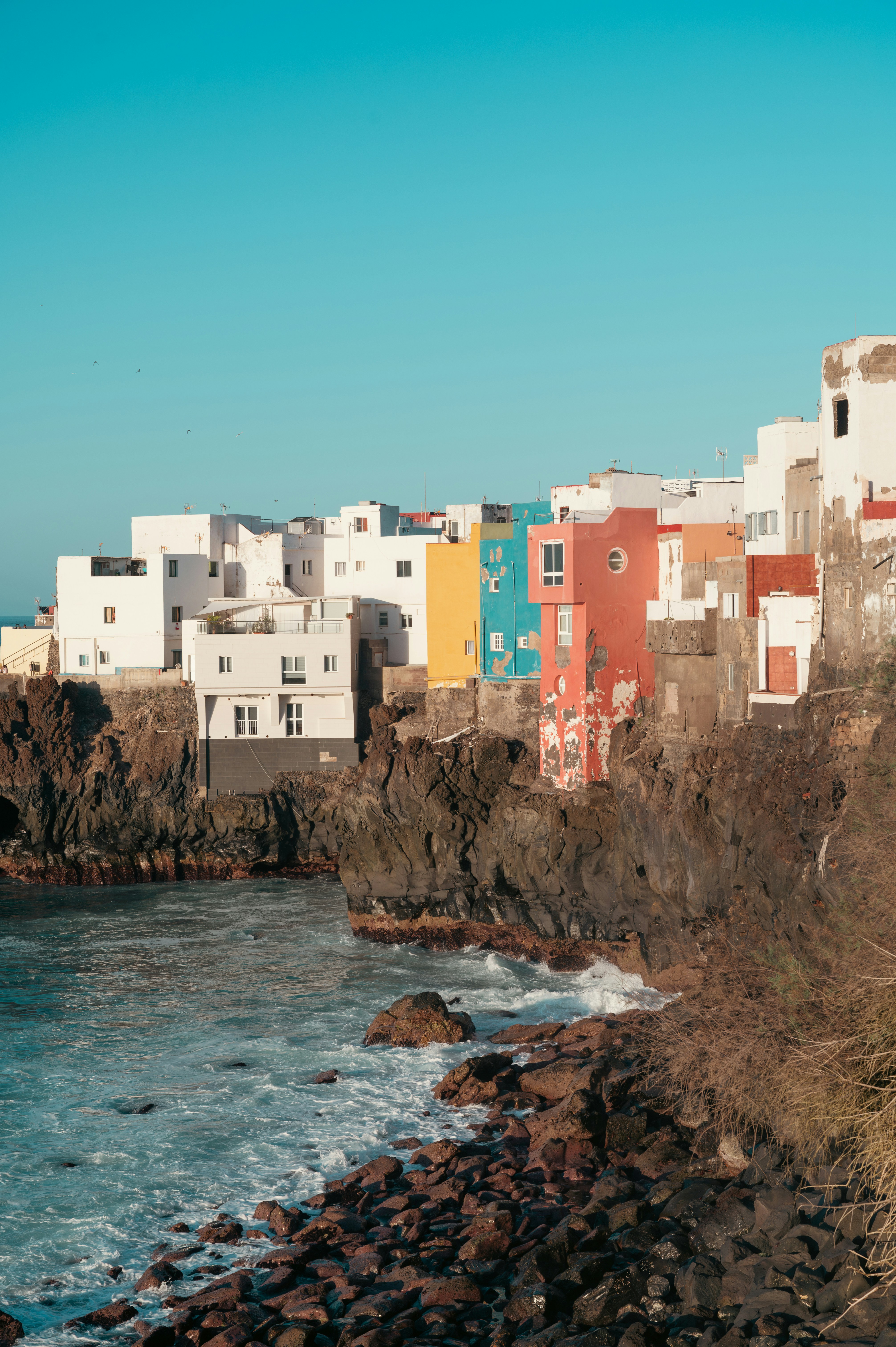 Colorful Cliffside Village Leaning Into the Sea
