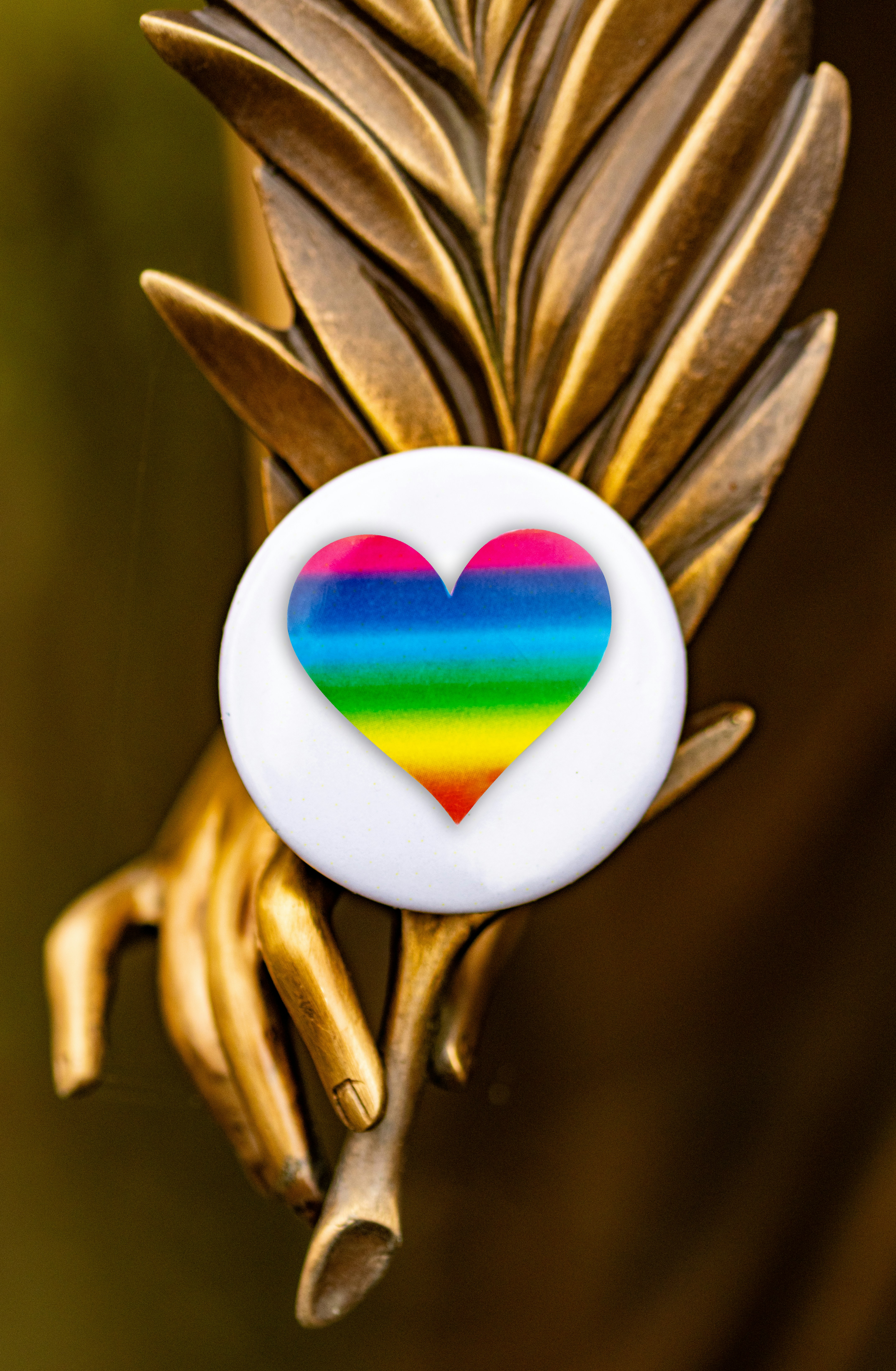 Rainbow Heart on a Gilded Leaf: a macro portrait of color against brass