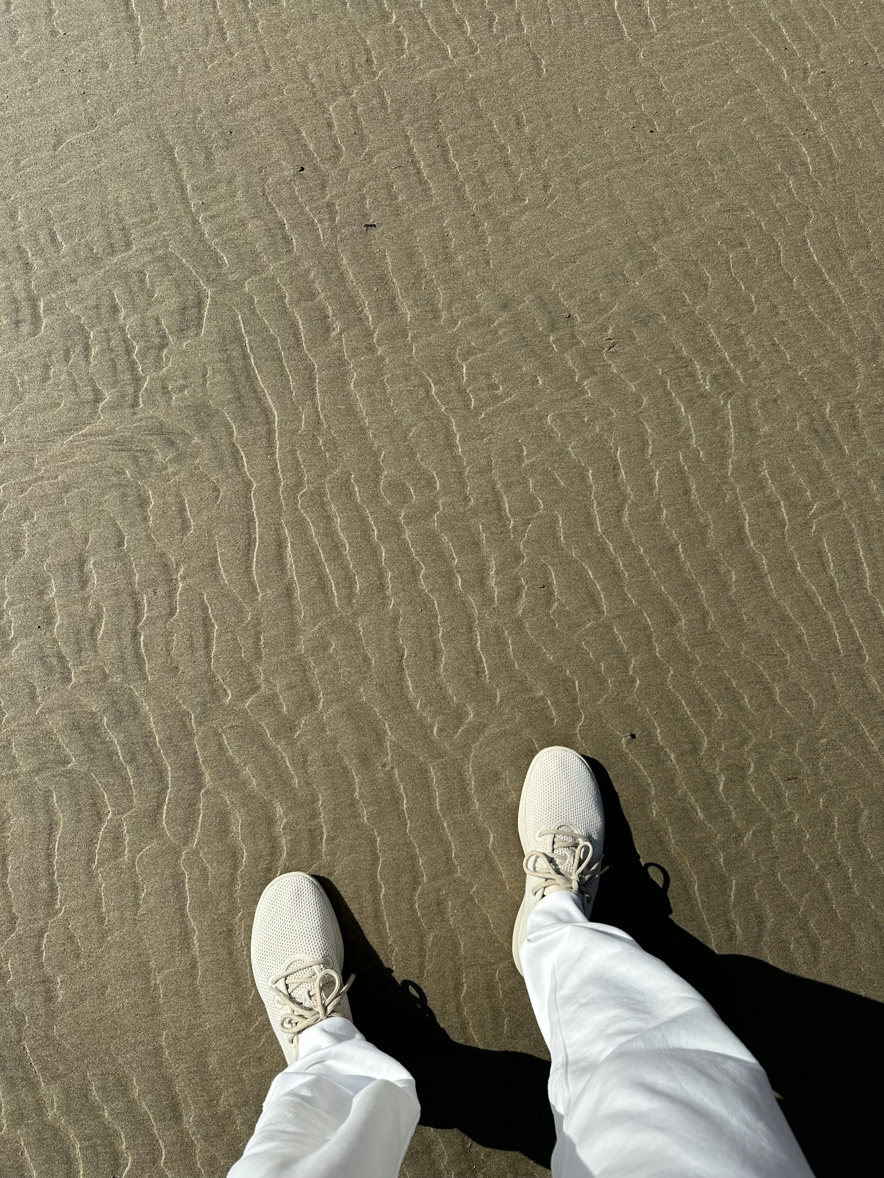 Soles on a Quiet Dune: Footwear Amid Wind-Carved Lines