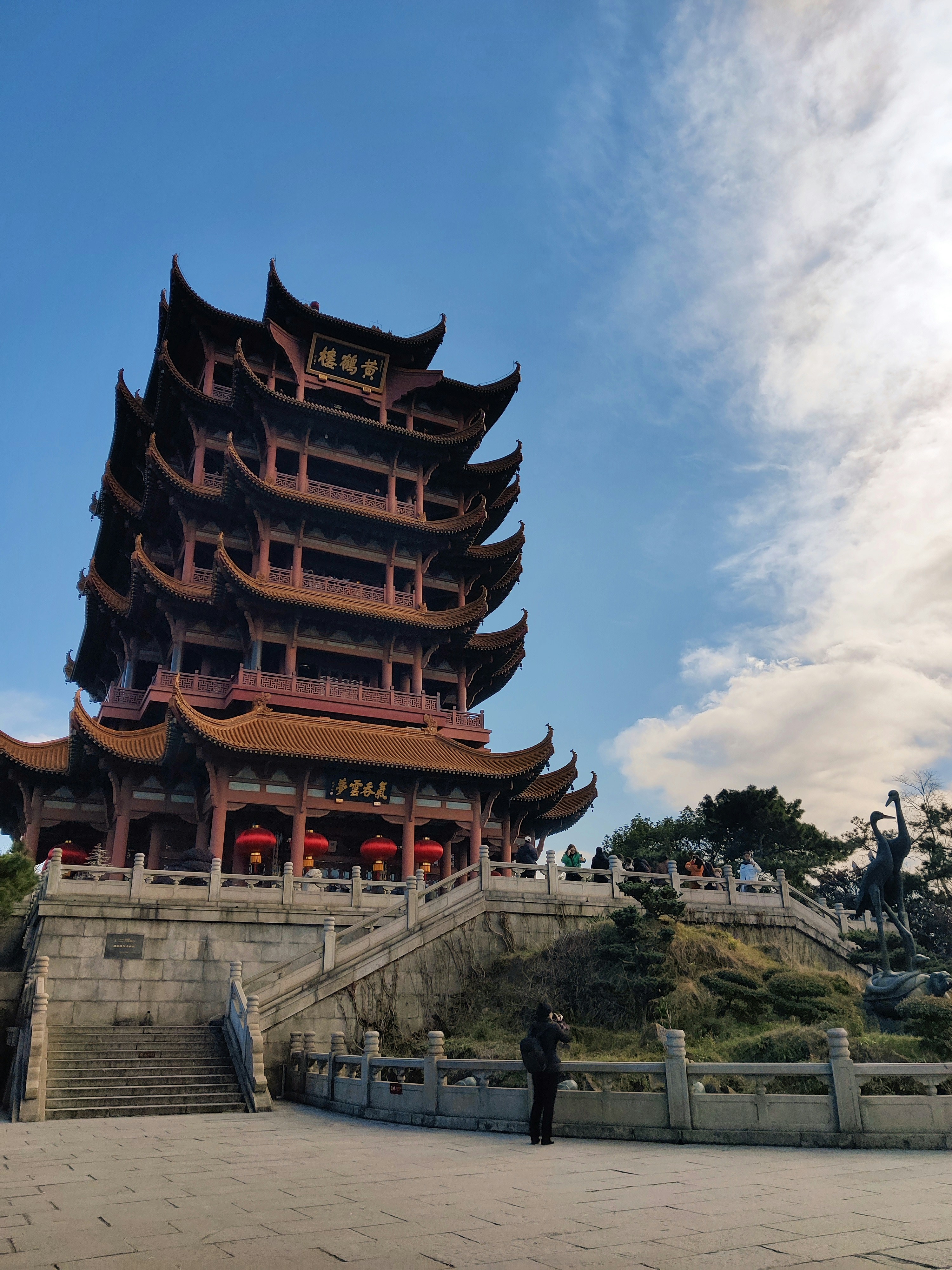 Pagoda in Blue Sky: A Terraced Structure Reaching Toward the Clouds