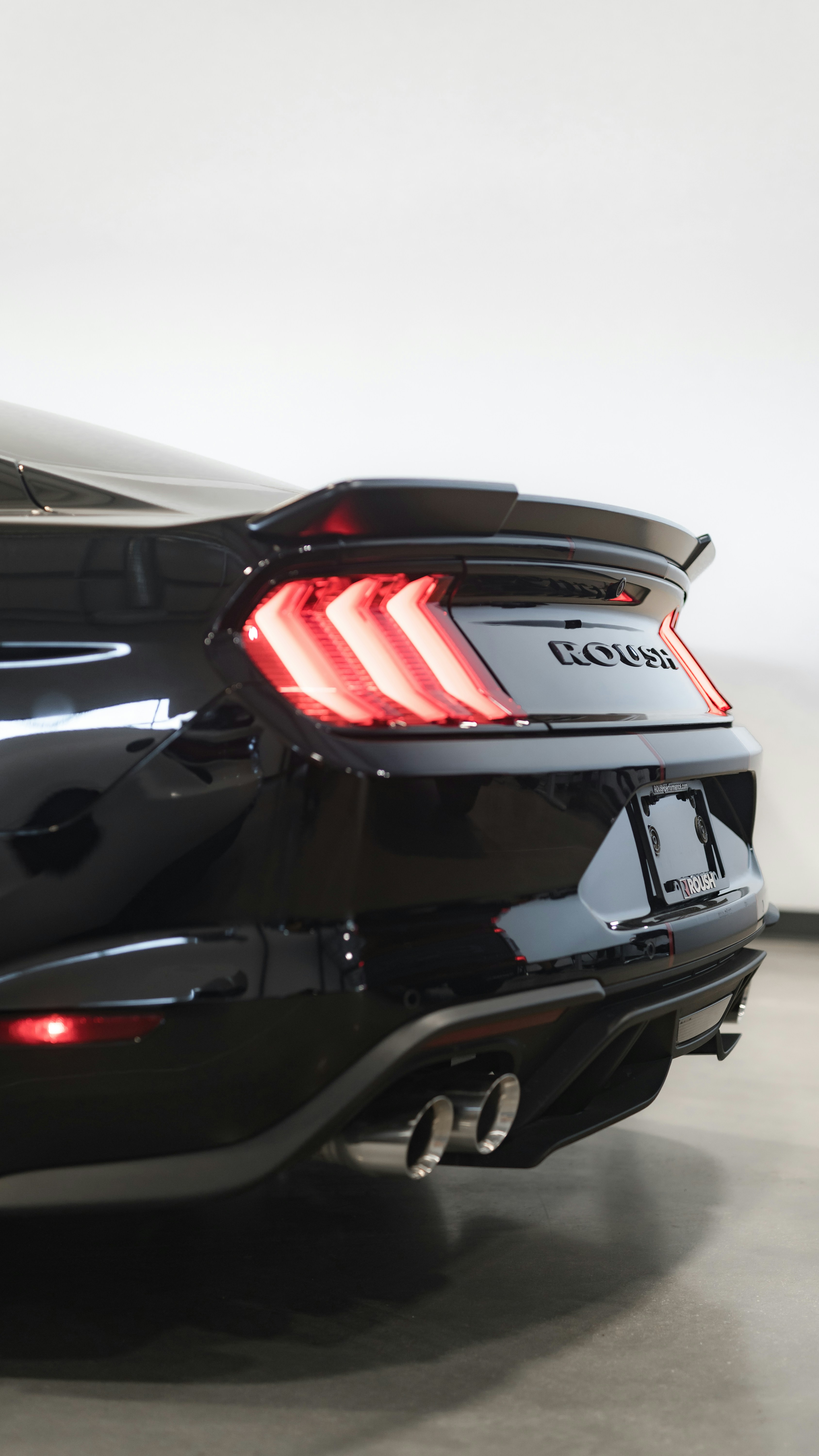 The rear end of a black sports car photo – Free Sportcar Image on Unsplash