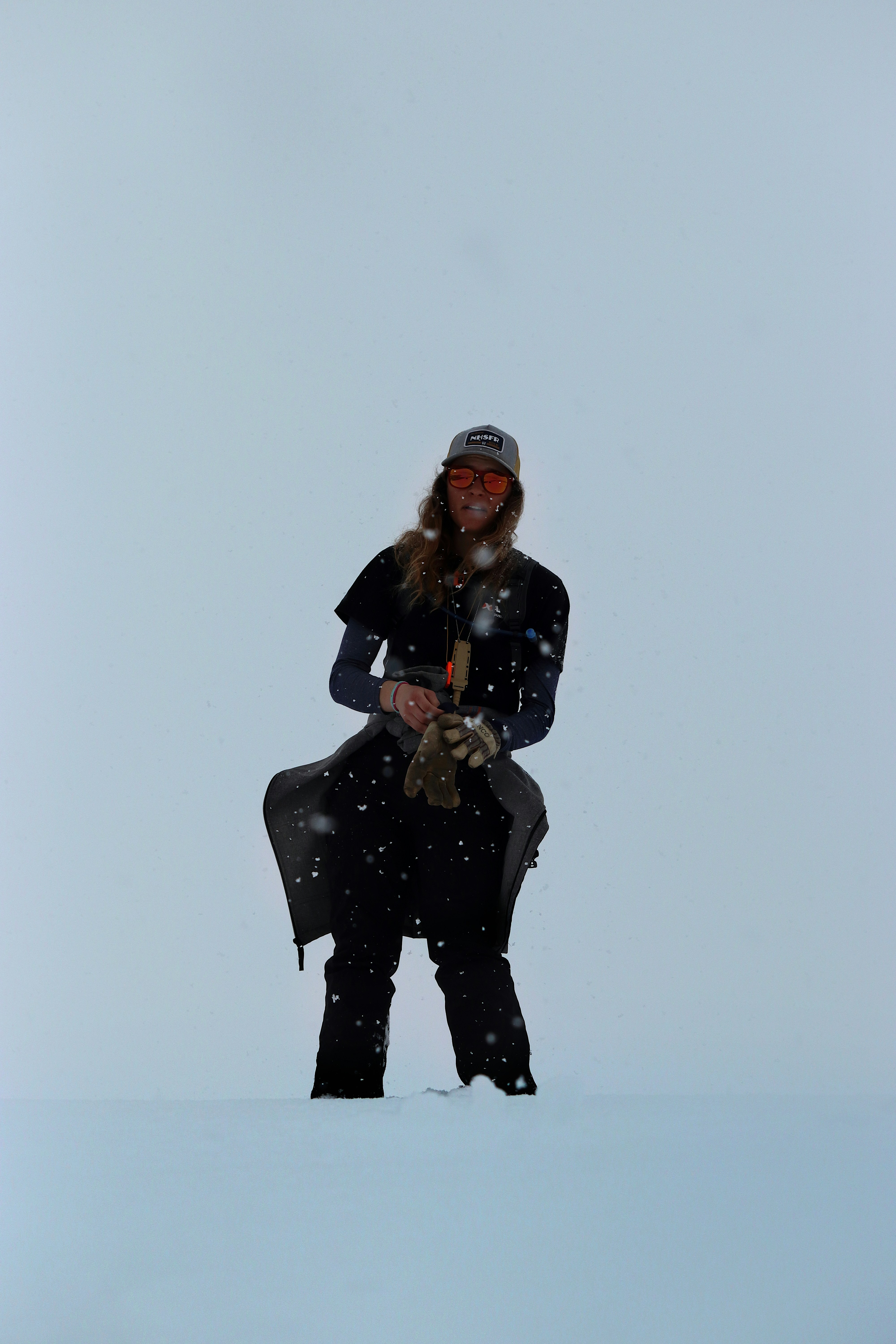 Snowbound Figure: A solitary moment of quiet in a drifting white expanse