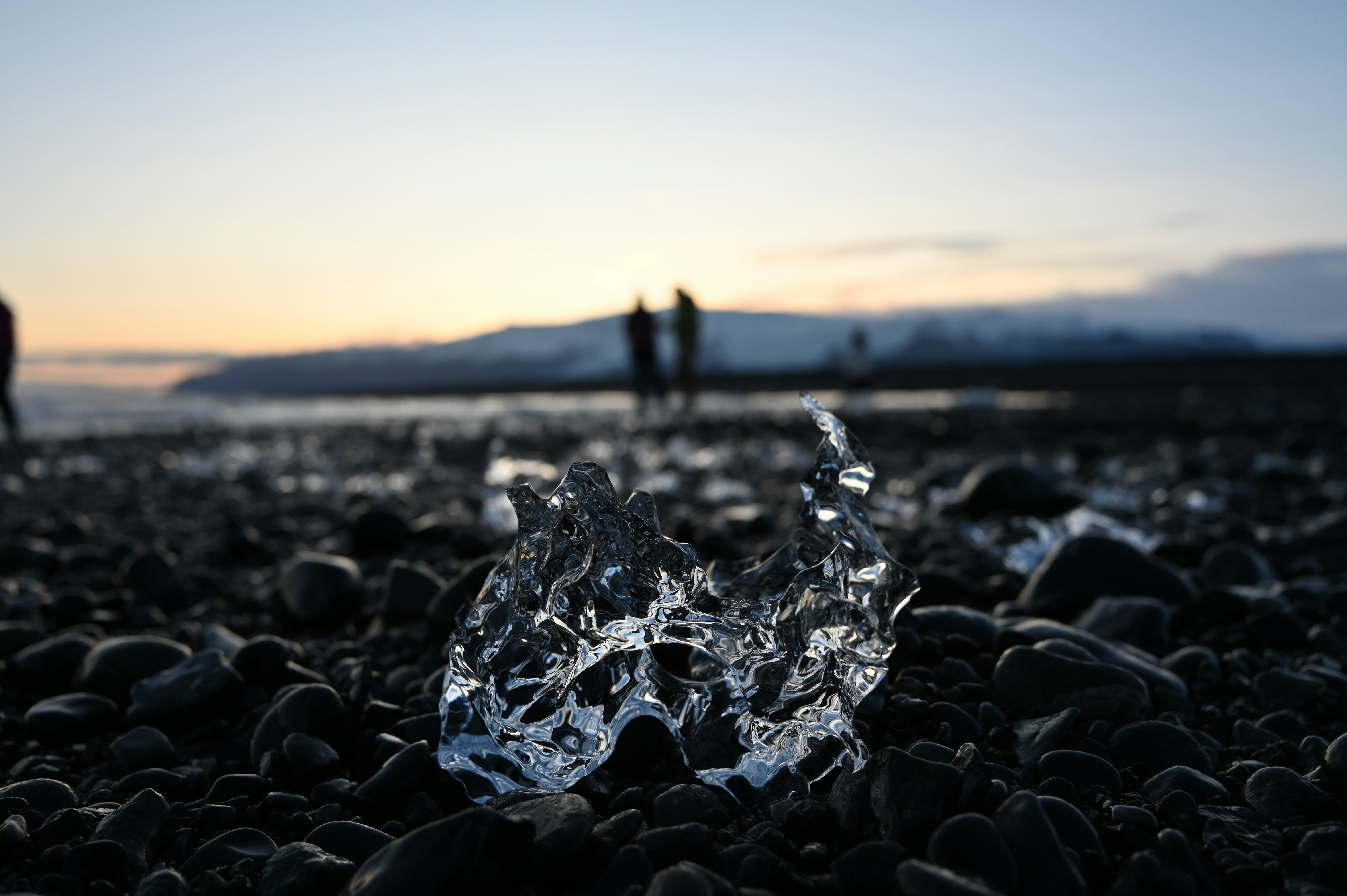 Icebound Island: a Pool of Light on a Pebble Beach