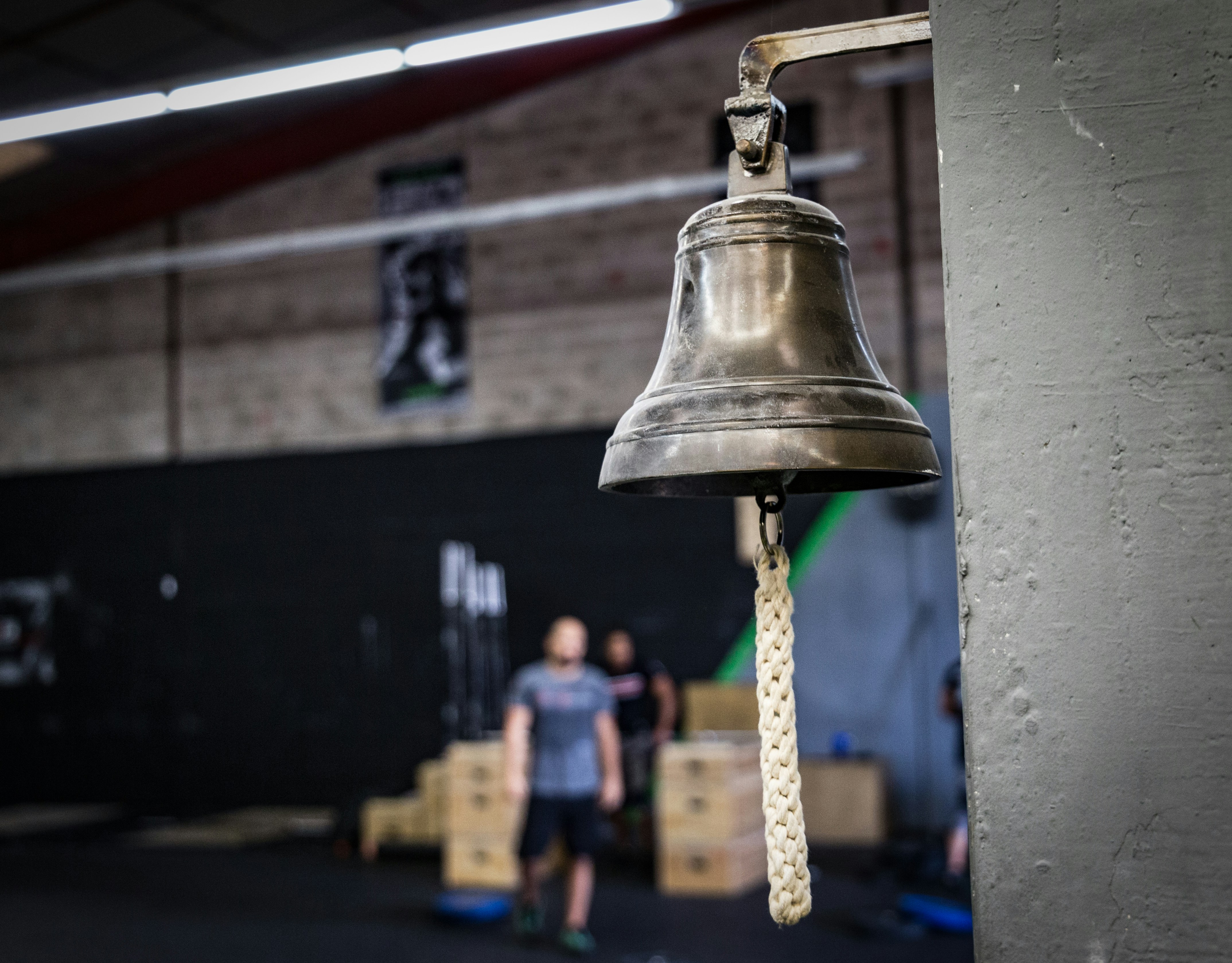 a bell hanging from the side of a building