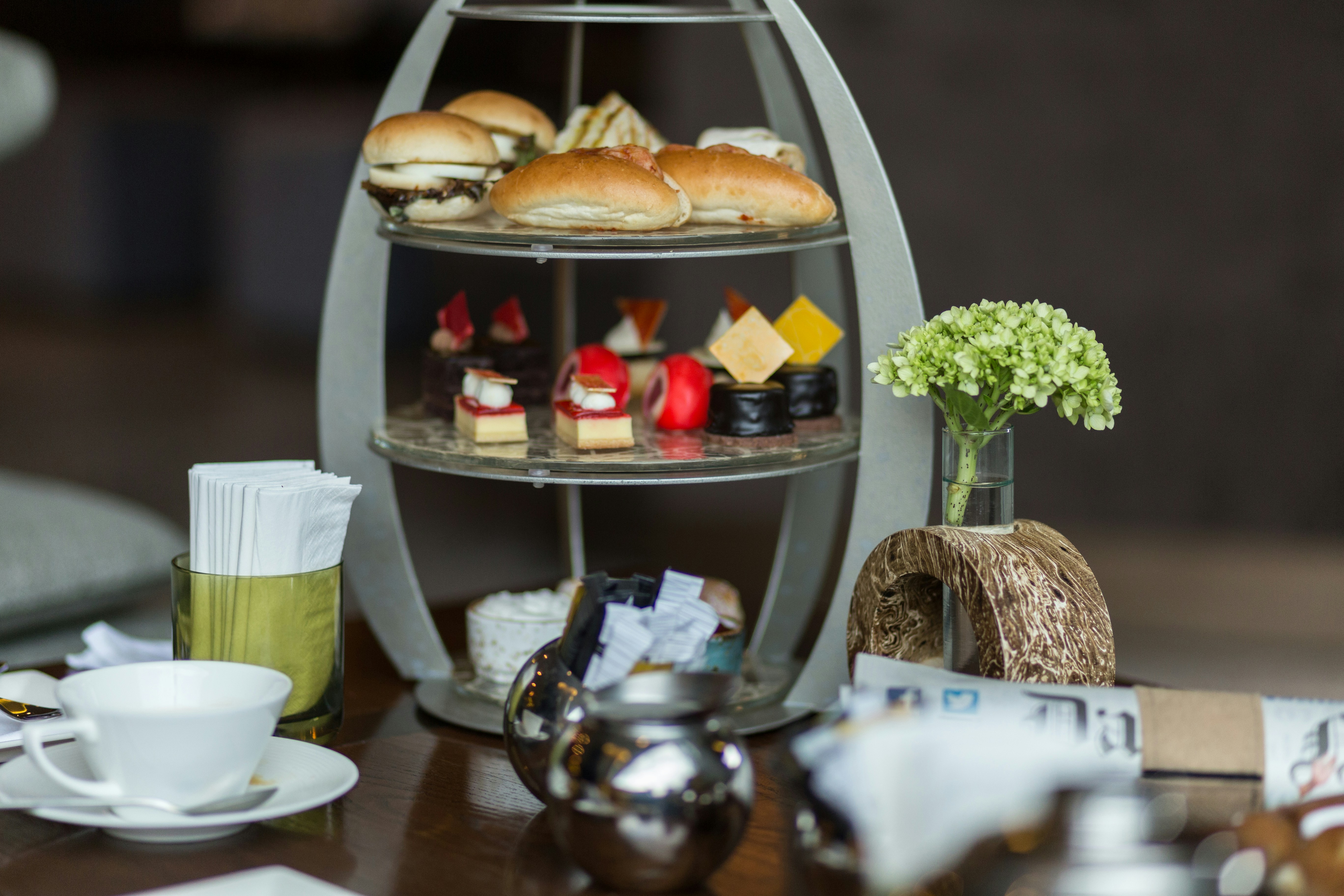 Tiered Delight: A Café Dessert Tower Framed in Soft Light