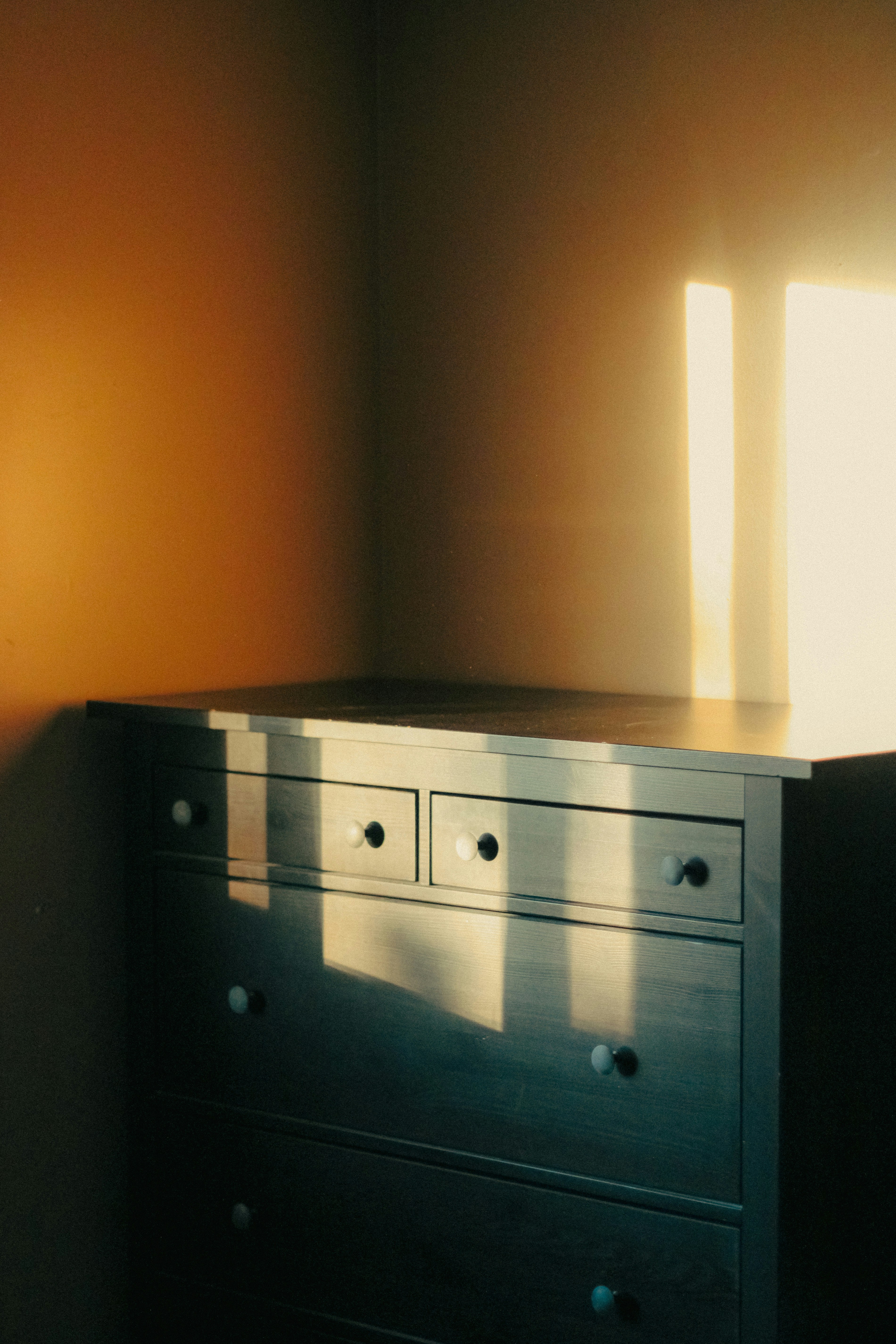 Sunlit Rectangles on a Quiet Chest of Drawers