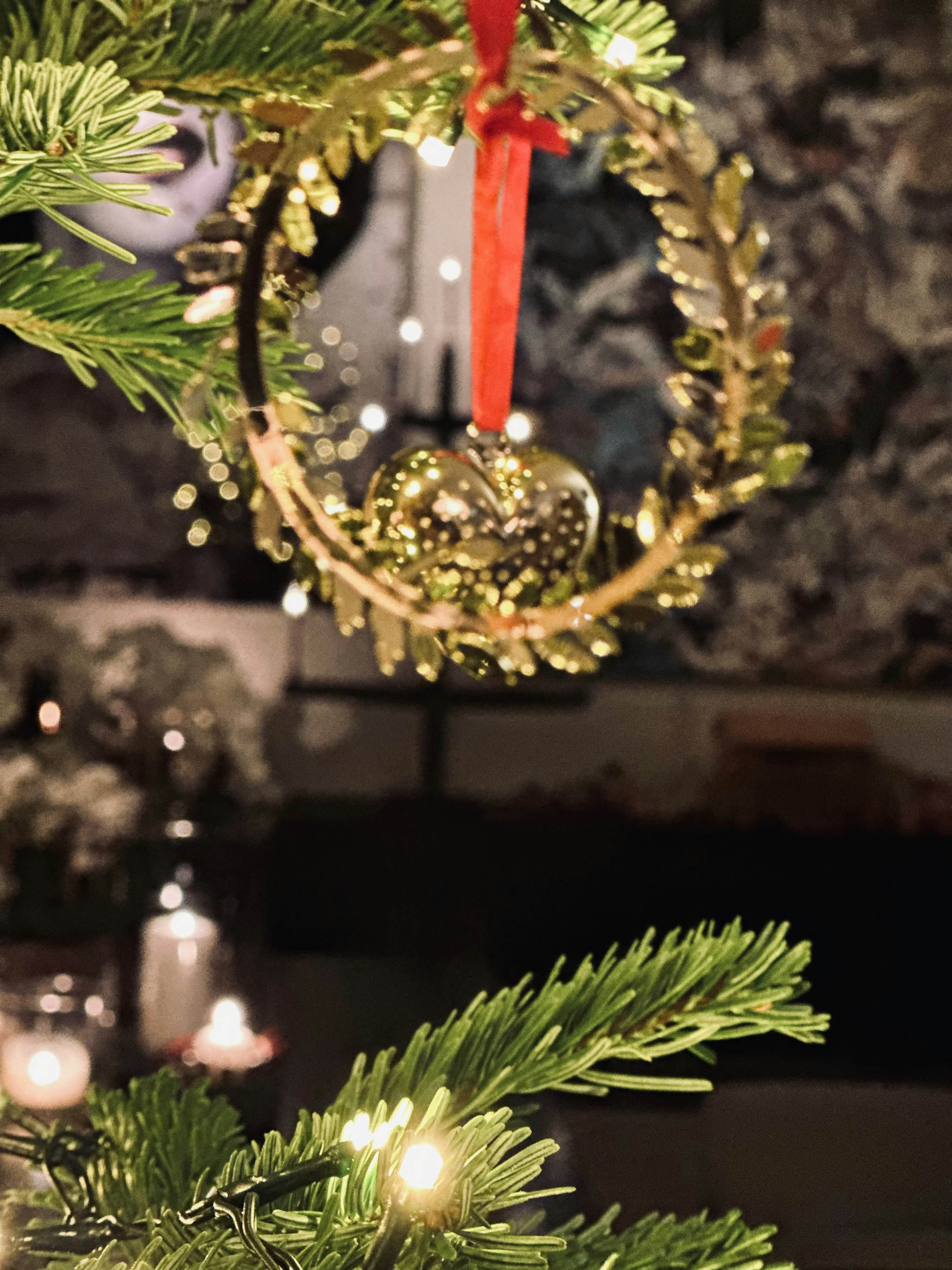 Gold Heart Pendant Framed by a Festive Ring Under Soft Bokeh Lights