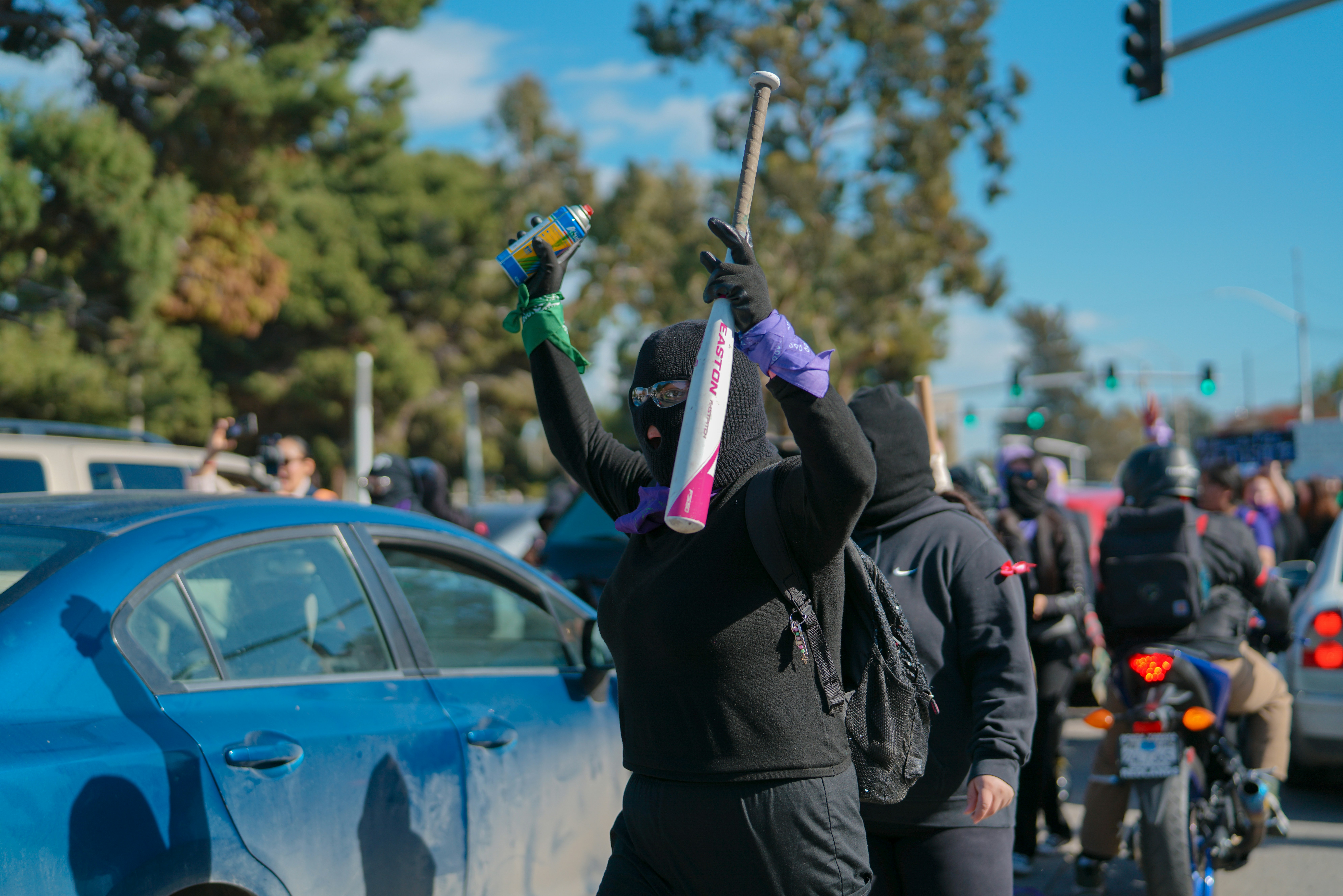 Raised Tools on a Sunlit City Street: A Protest in Motion