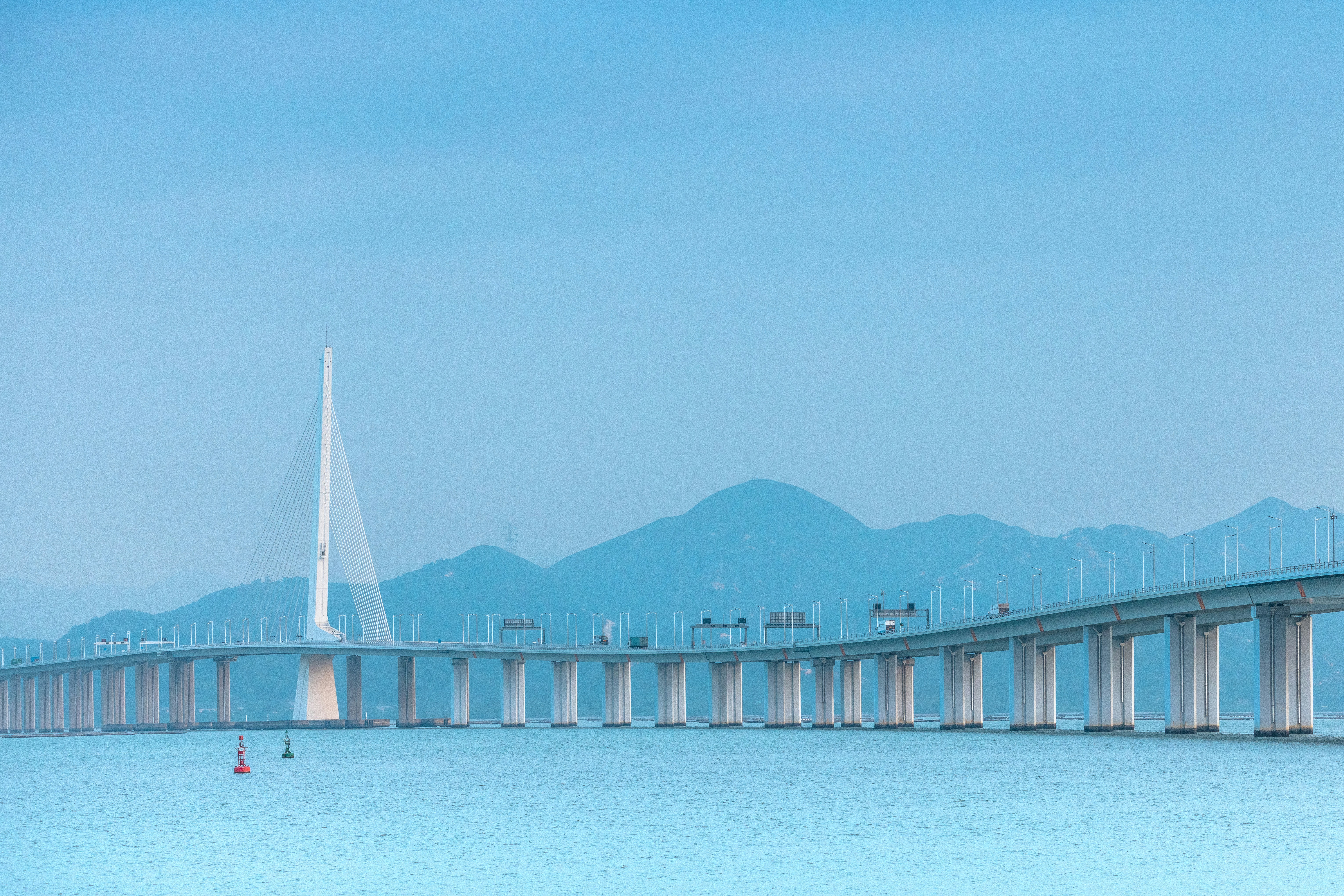 A large bridge over a large body of water photo – Free Blue Image on ...