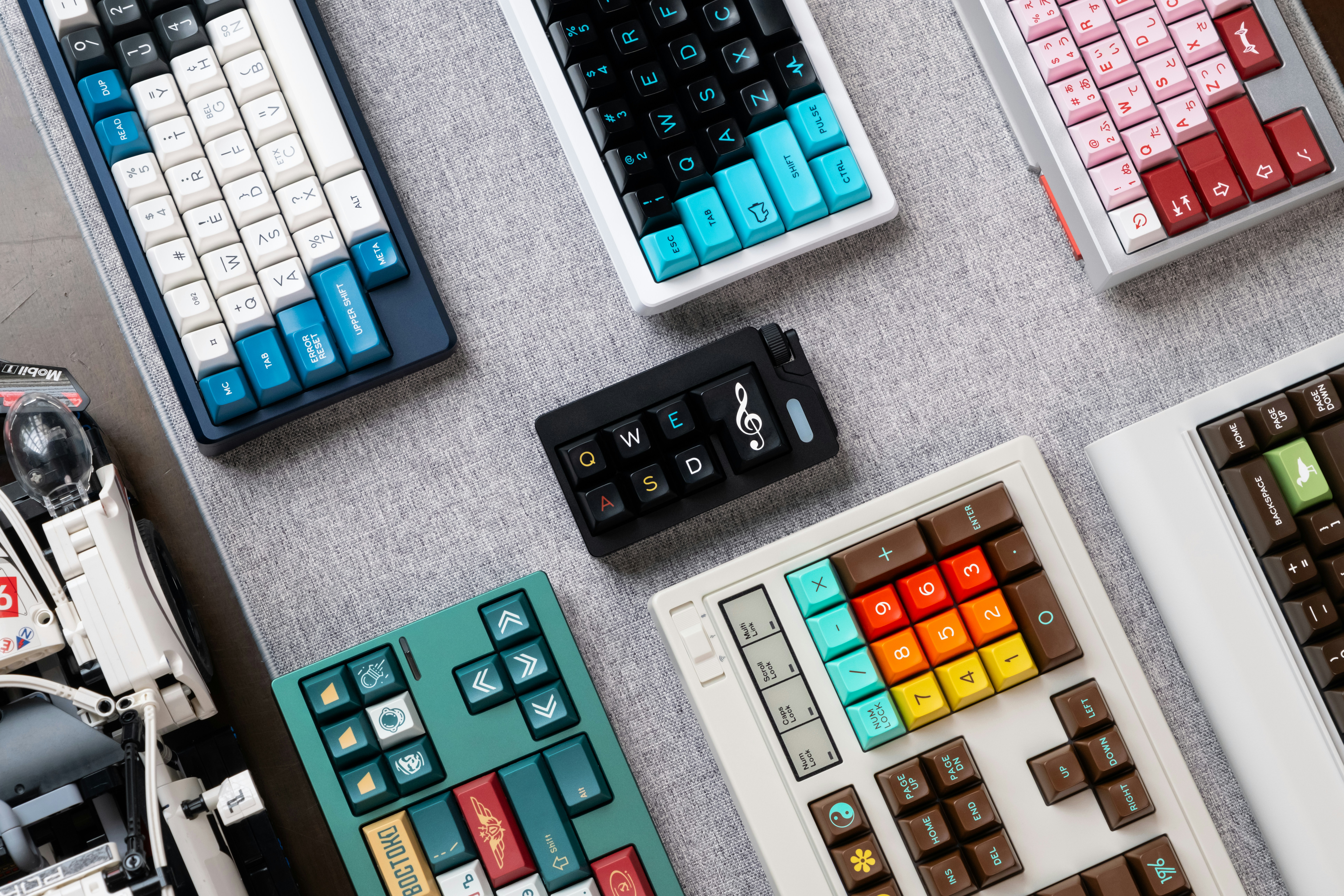 A bunch of different colored keys on a table photo – Free Keyboard ...