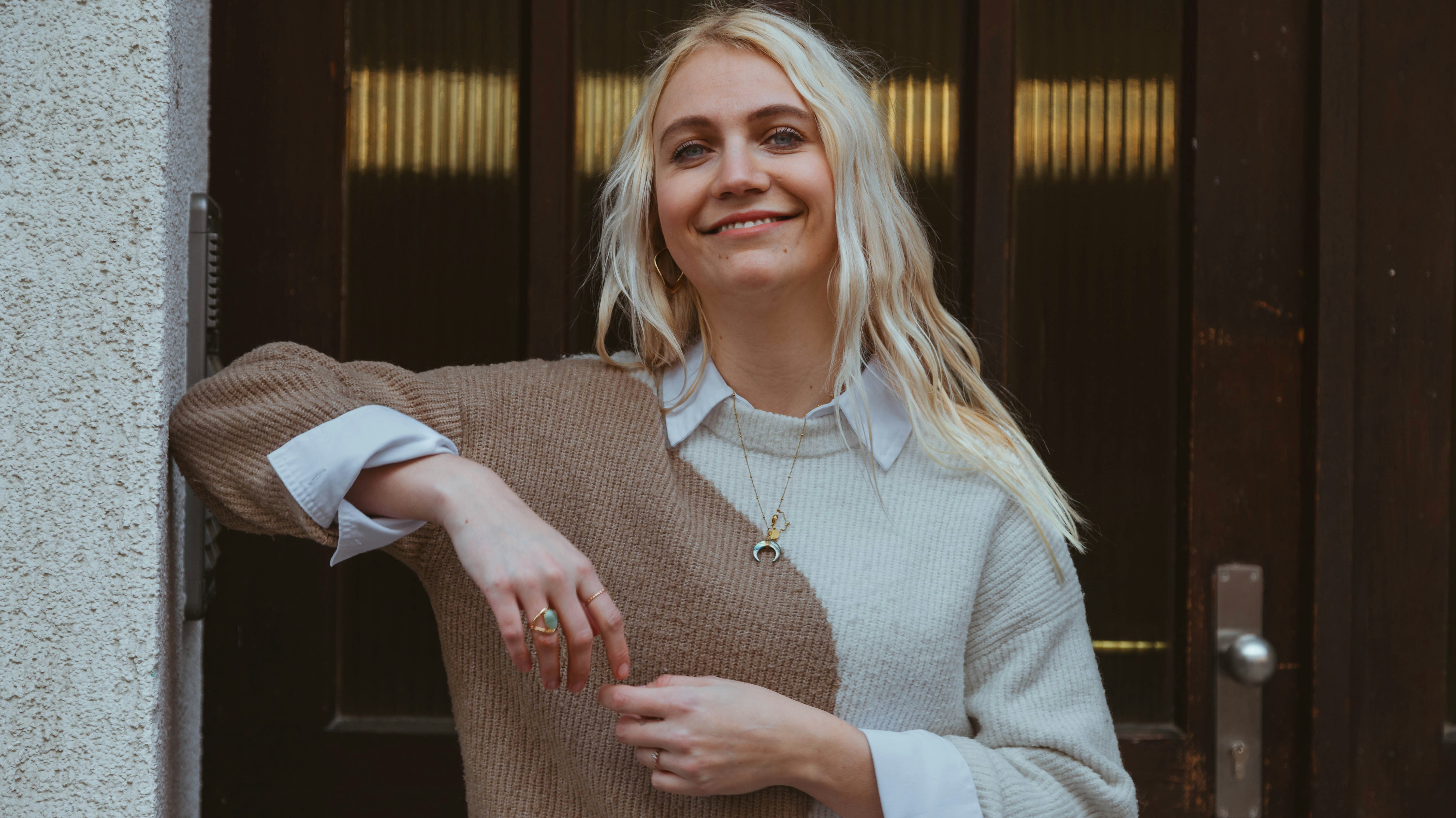 Pastel Light at the Doorway: A Quiet Portrait in Beige Knit