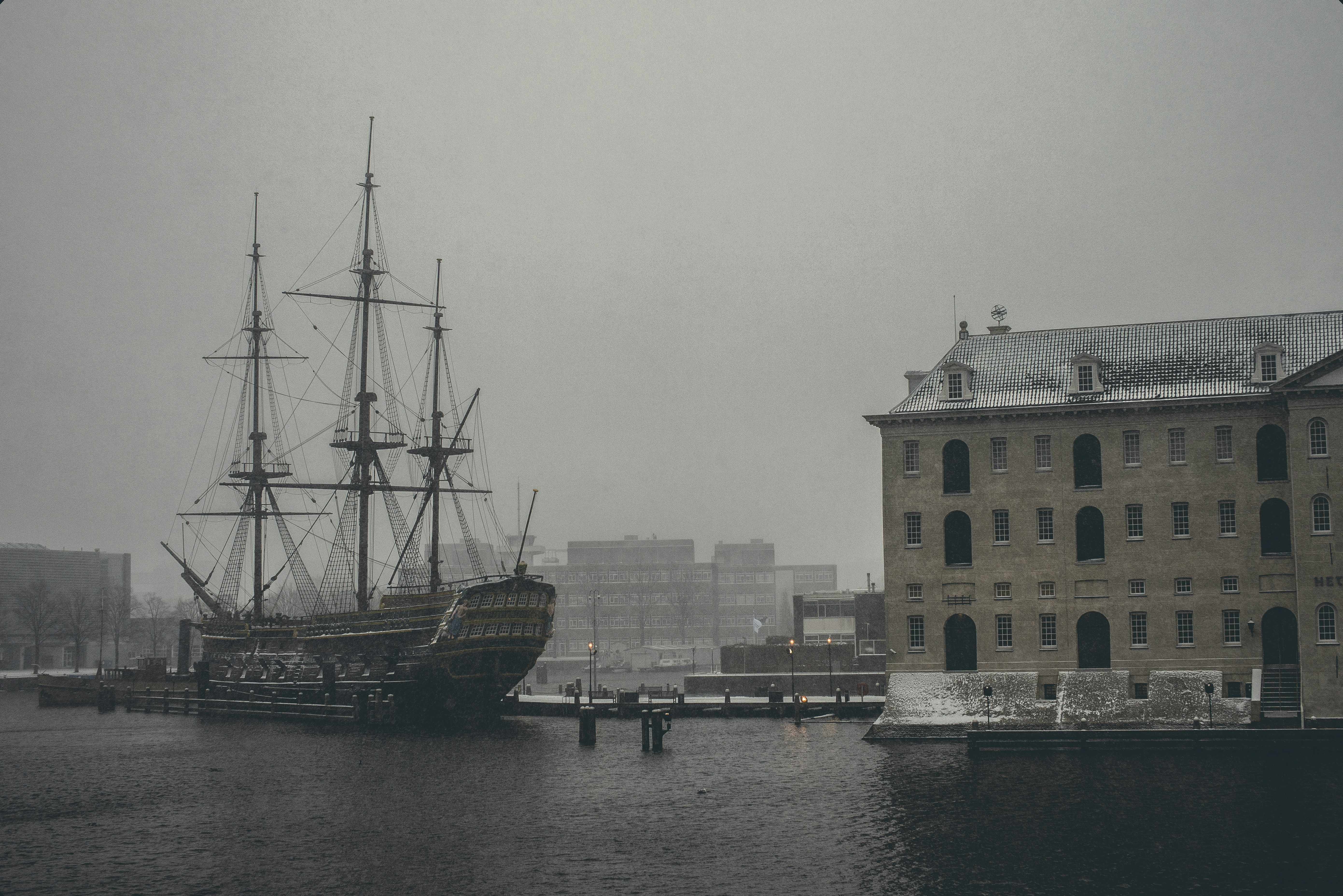 Three-Masted Ghost at the Quay: A Monochrome Harbor Tale