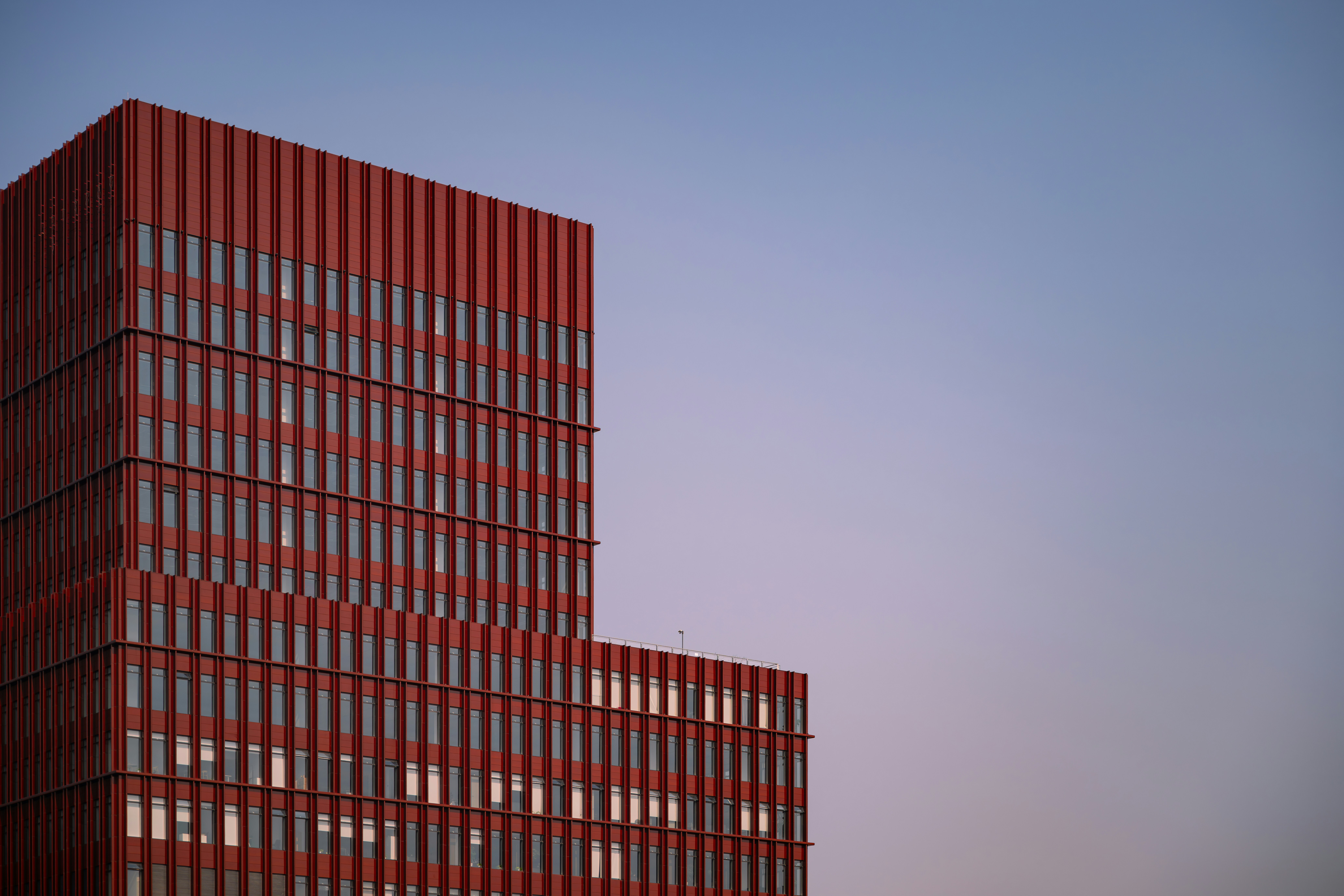 A tall red building with lots of windows photo – Free China Image on ...