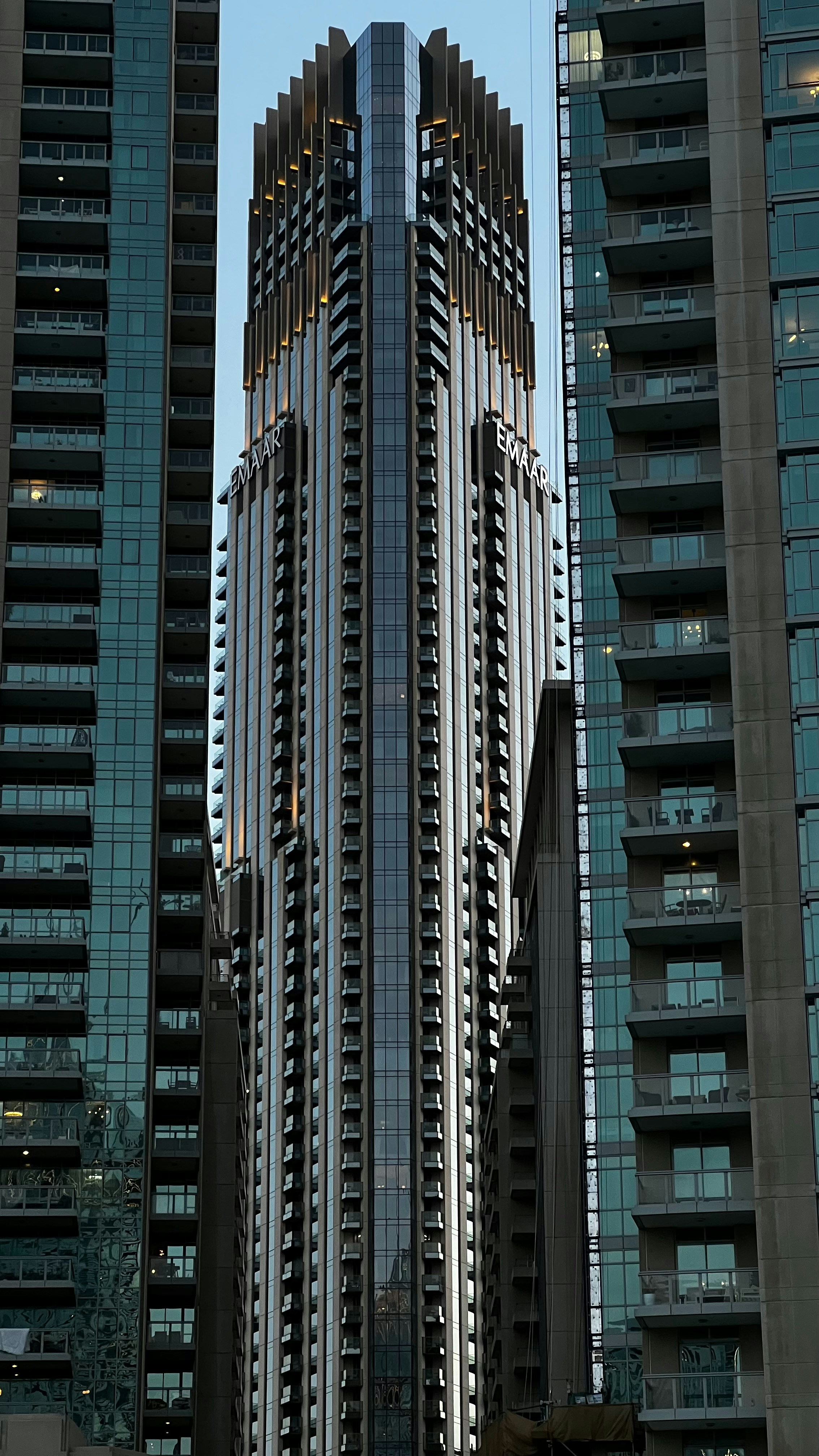 A very tall building surrounded by other tall buildings photo – Free ...