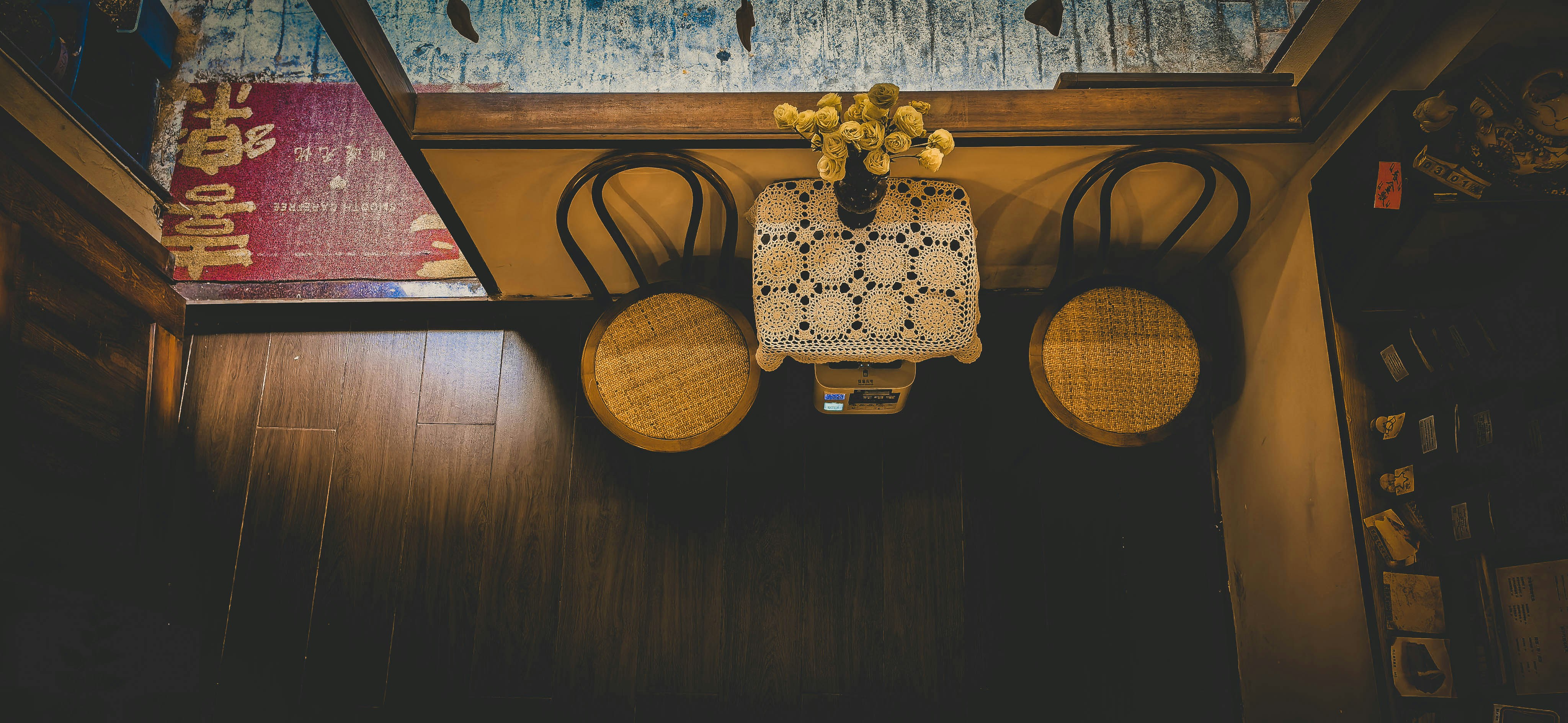 Floral Centerpiece in a Cozy Café Corner — A Top-Down Moment