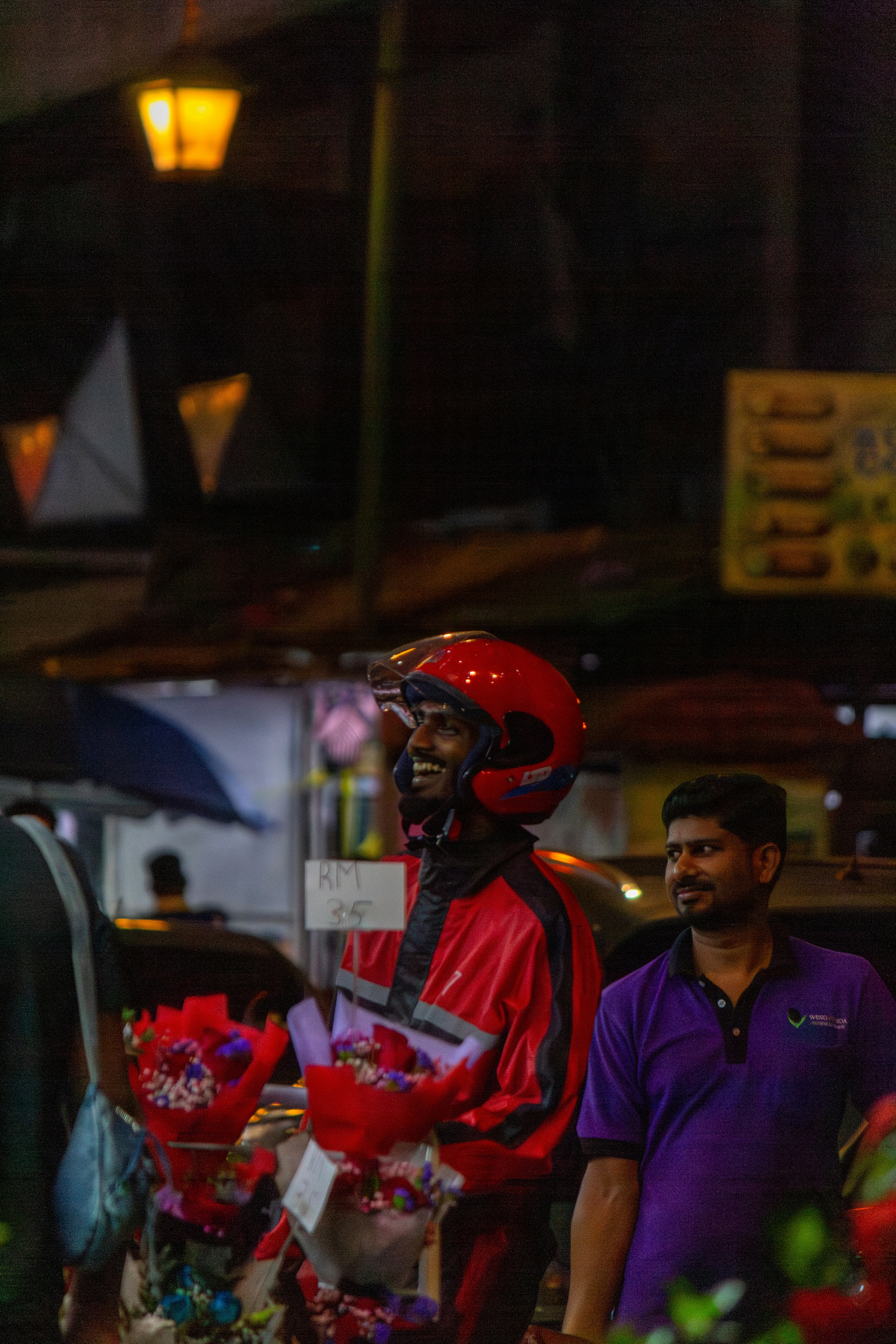 Night Market Portrait: Red Helmet, Warm Lights, and Blooming Bouquets