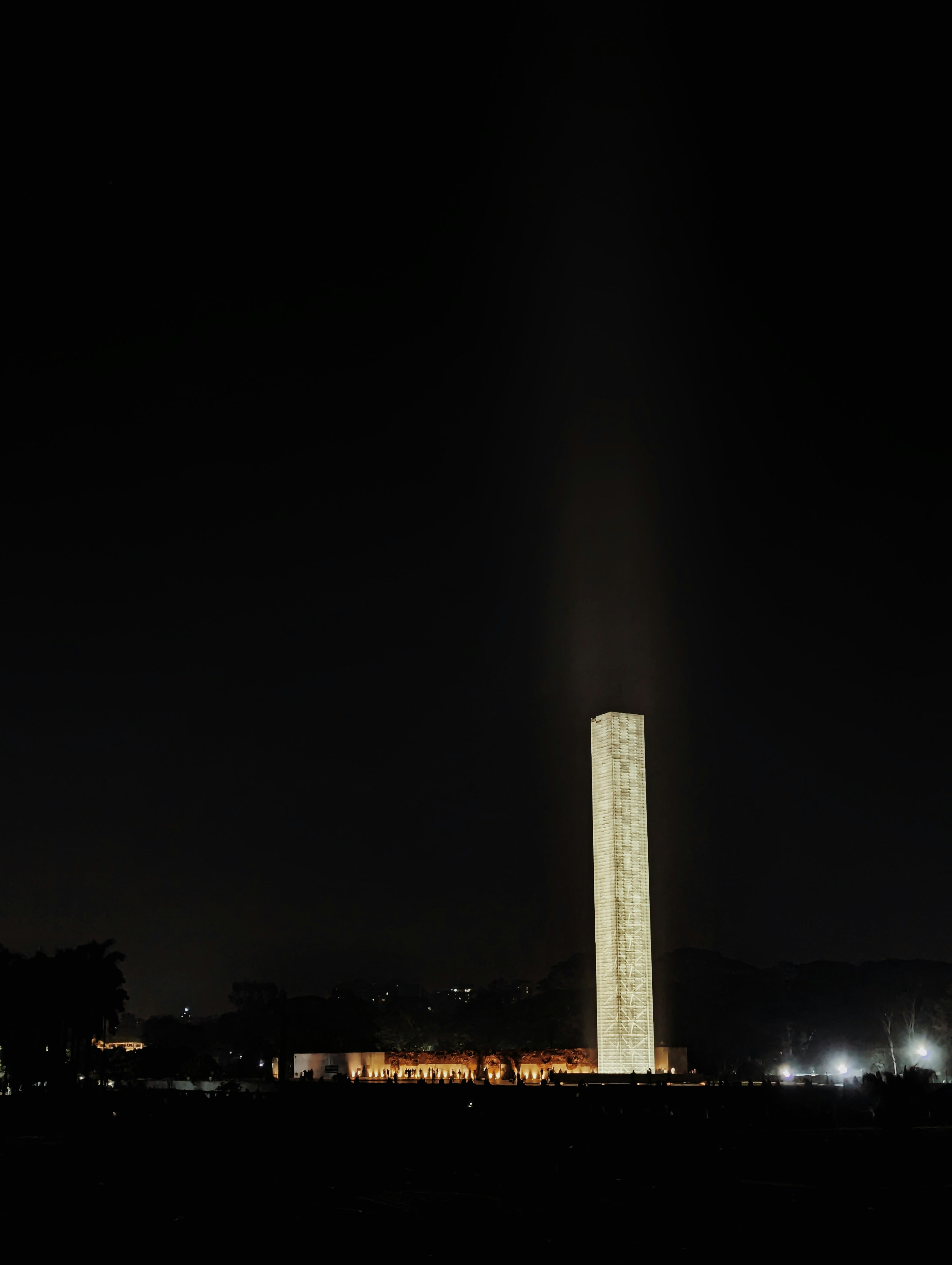 Night Beacon: The Obelisk Rising Over a Quiet Park