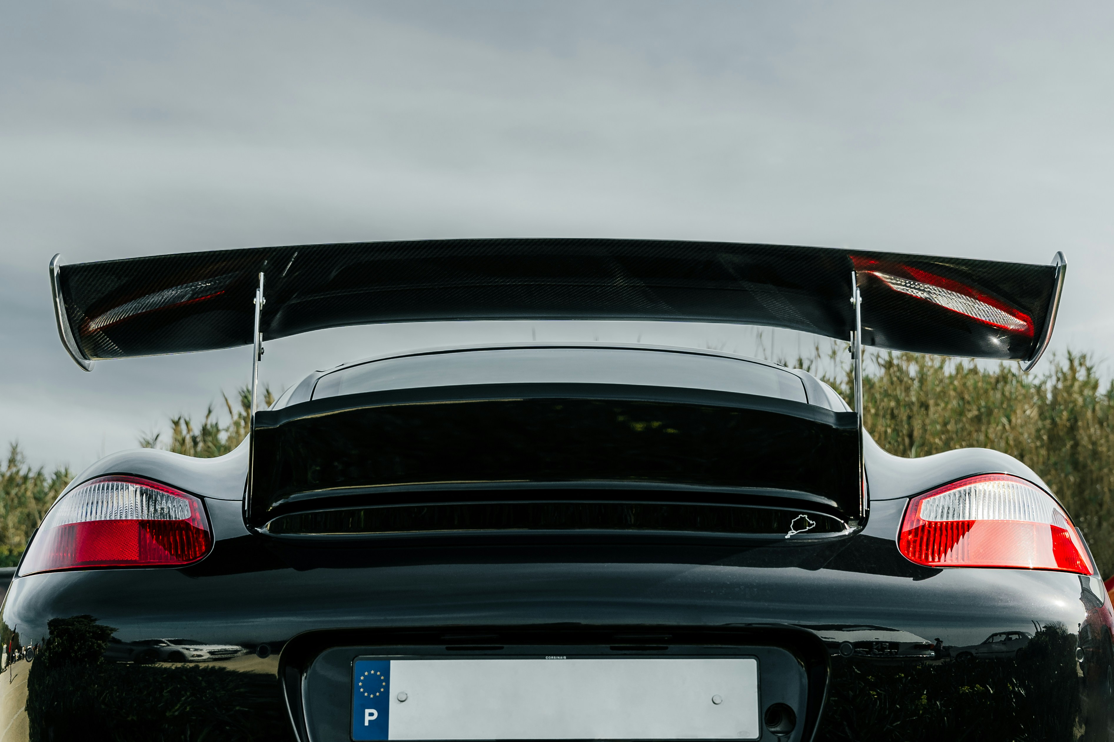 The back end of a black sports car photo – Free Porsche Image on Unsplash
