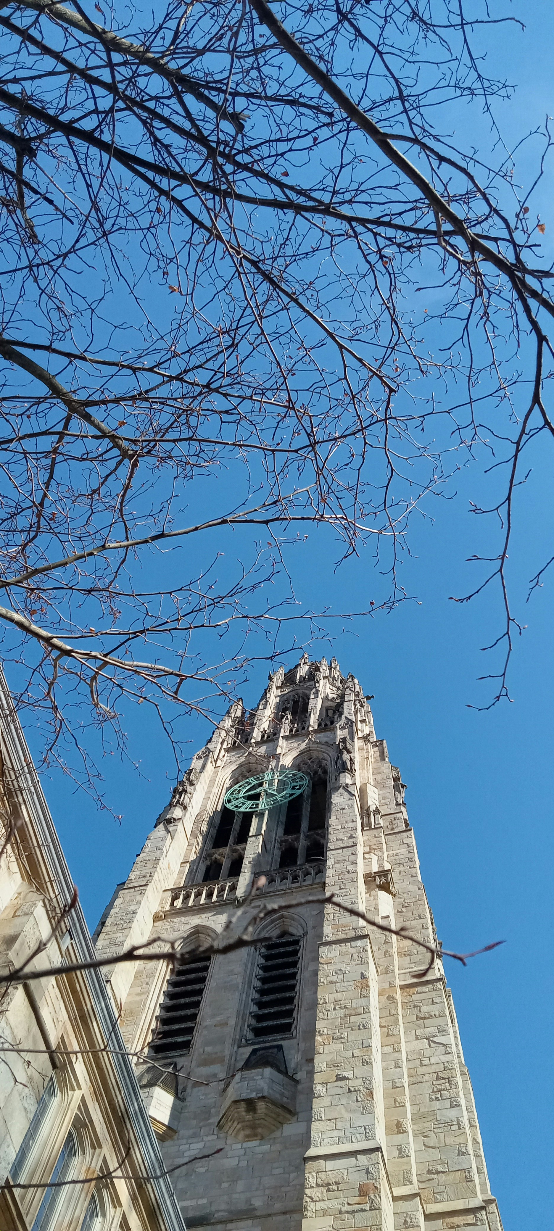 A tall tower with a clock on the side of it photo – Free Yale ...