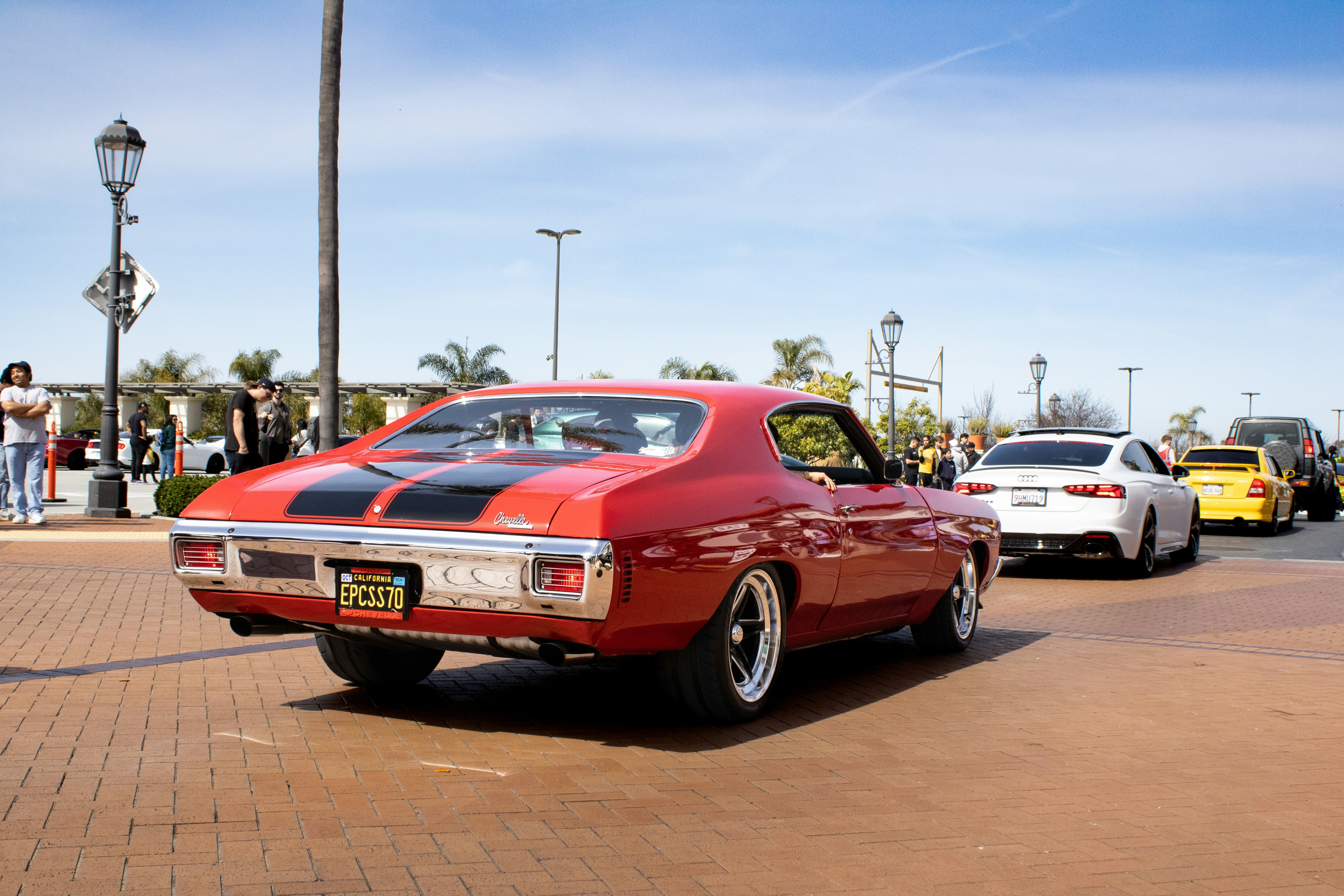 Crimson 1969 Chevelle SS at a sunlit brick promenade
